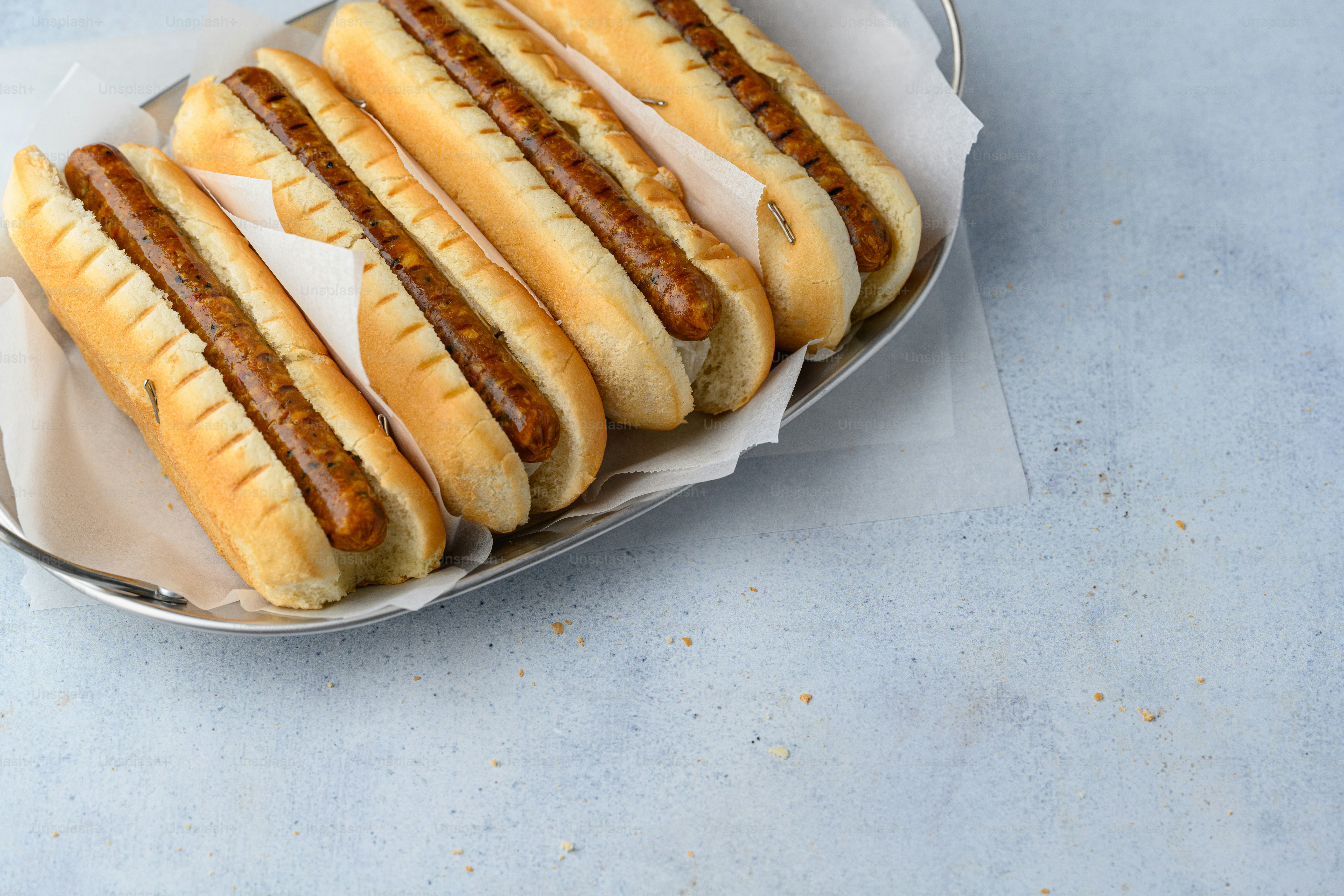 A bunch of hot dogs sitting on top of a pan photo – Health Image on ...