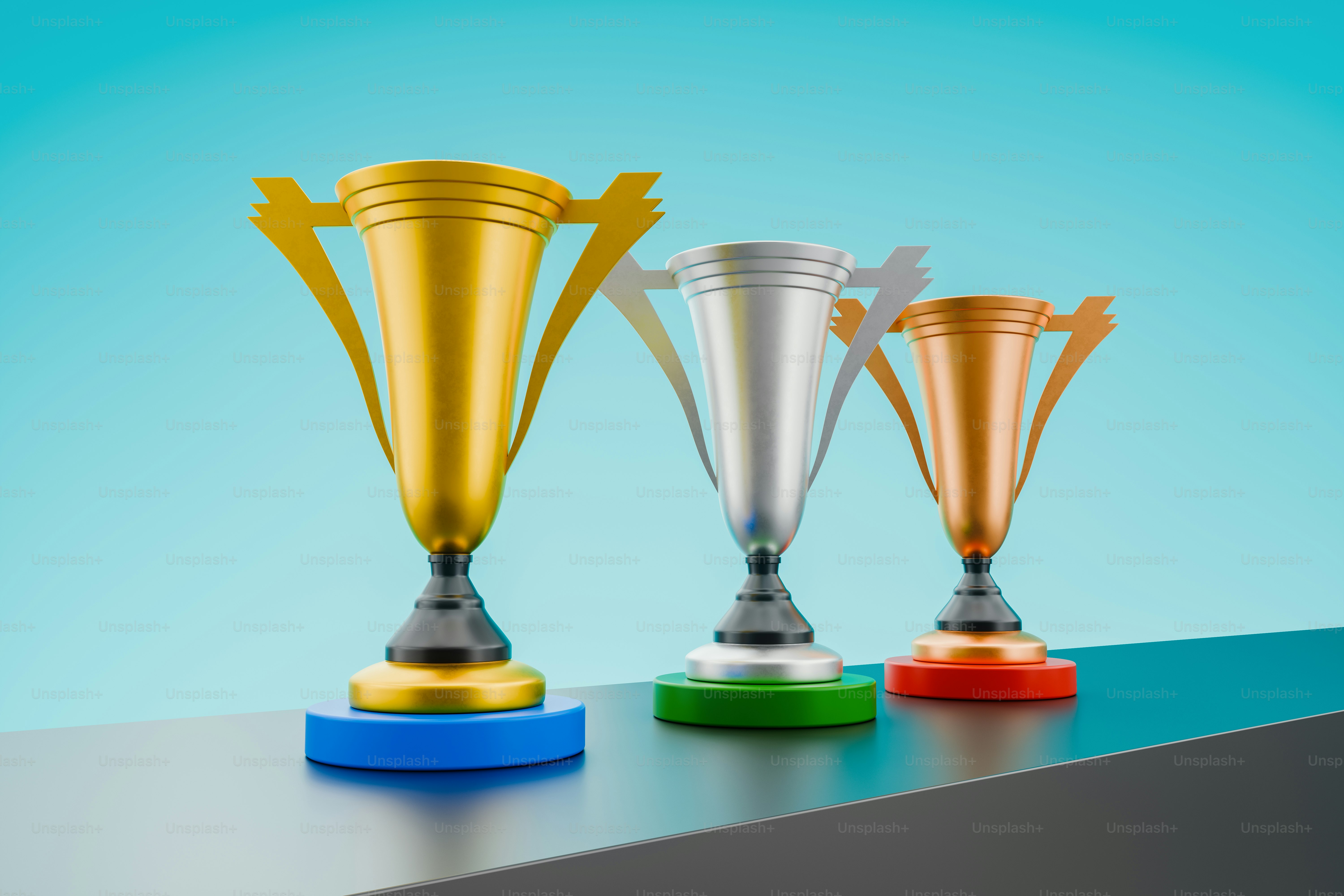 A group of three trophies sitting on top of each other photo – Trophy ...