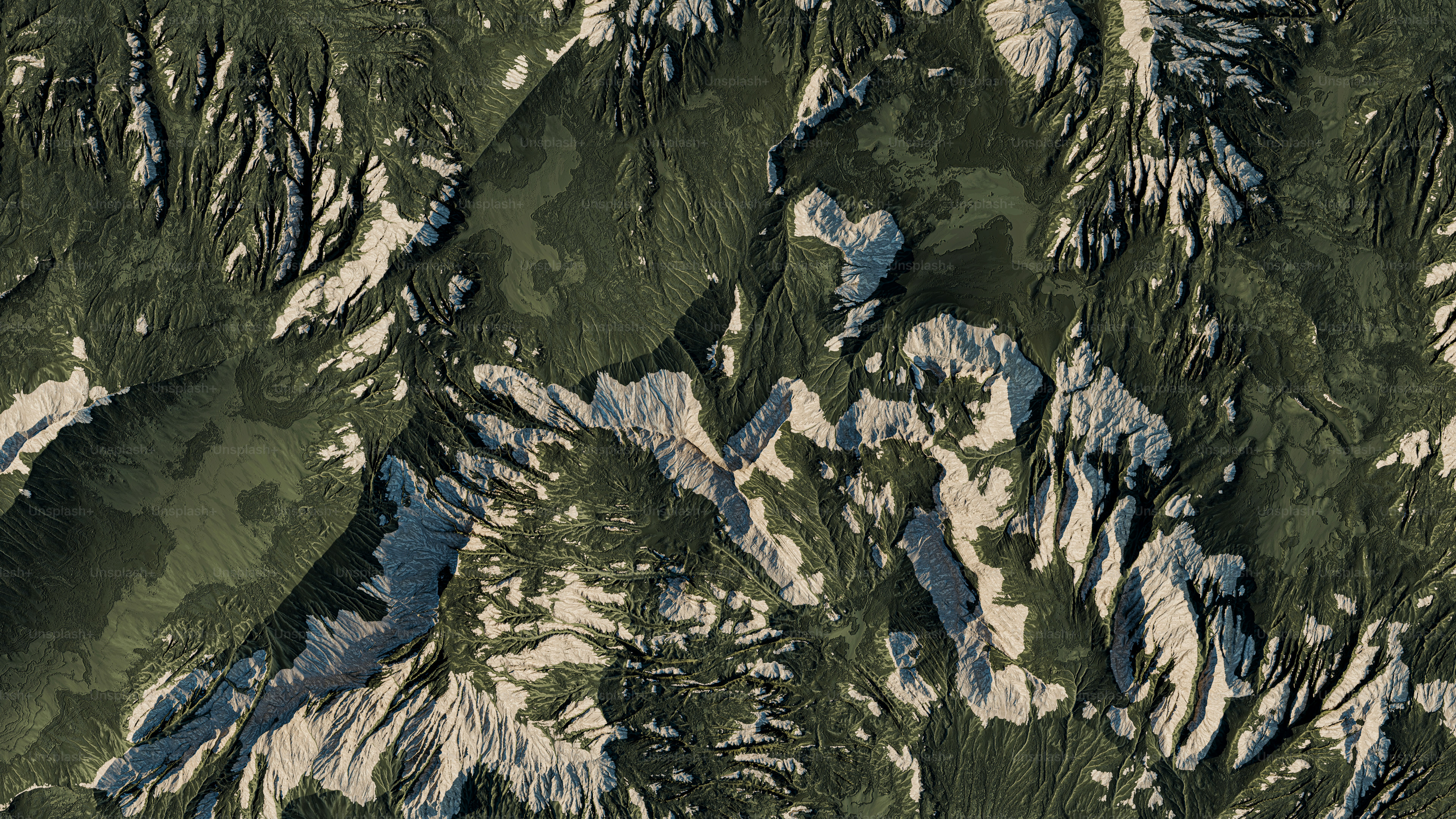 A satellite image of a green mountain range photo – Aerial view Image ...