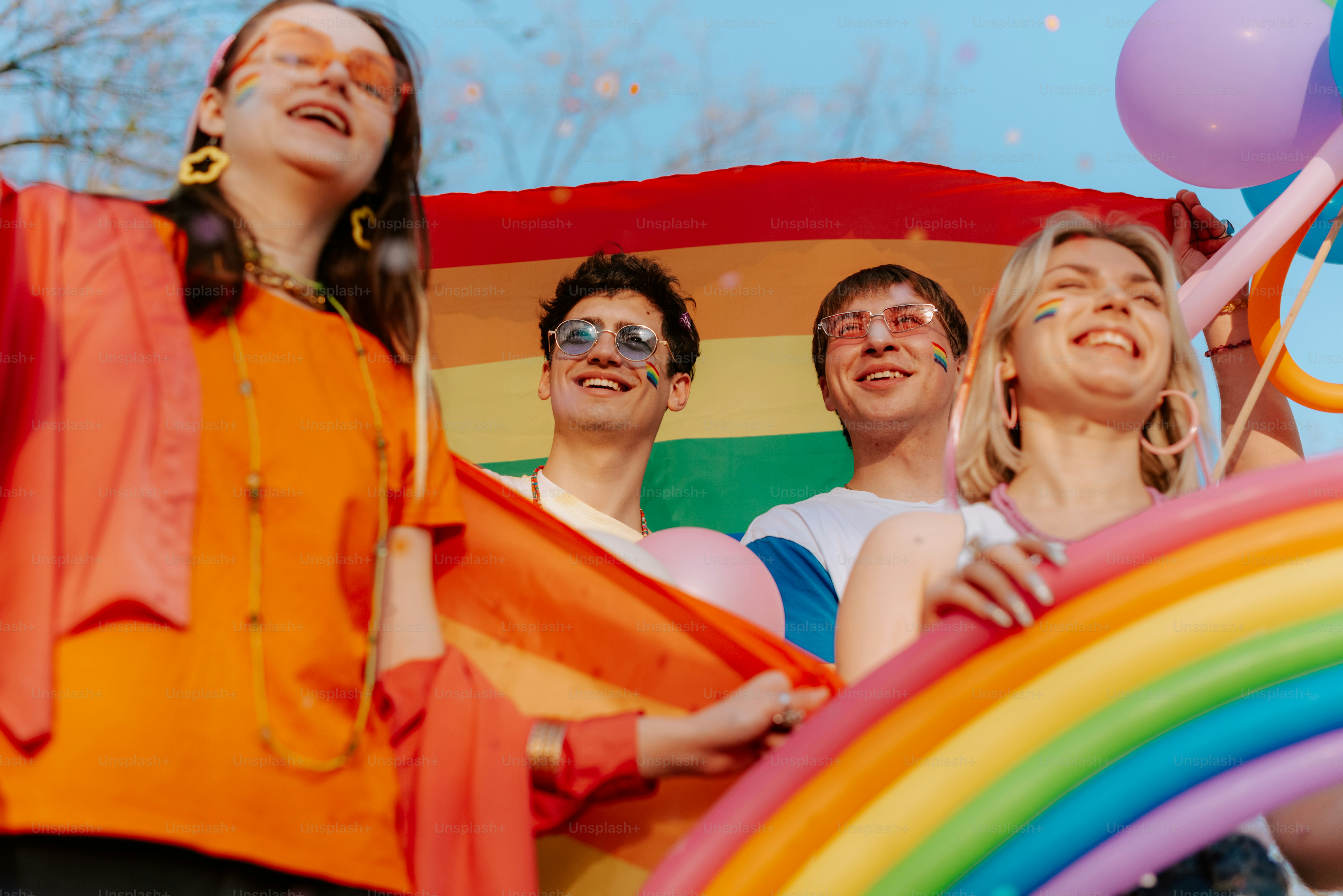 A group of people standing next to each other photo – Parade Image on ...