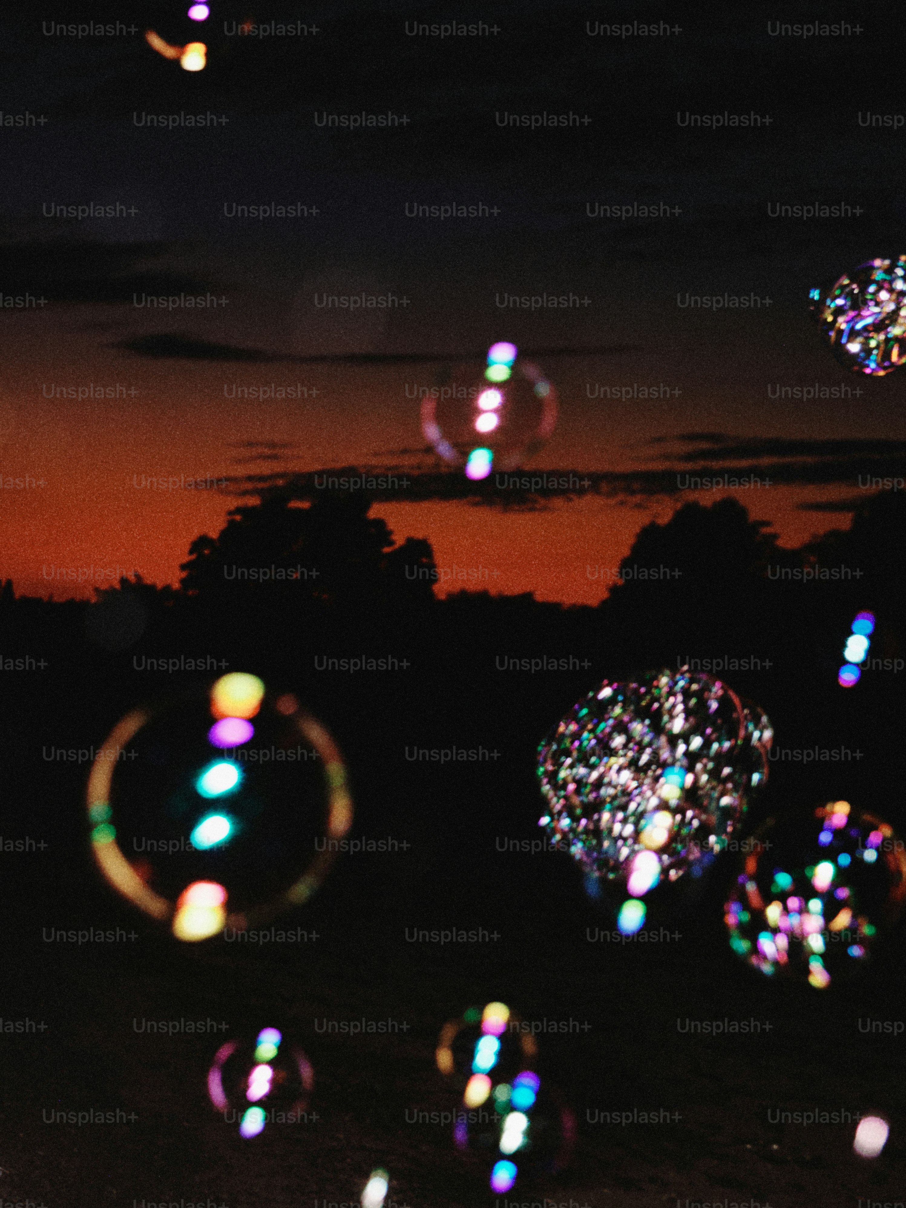 A group of bubbles floating in the air photo – Candid Image on Unsplash