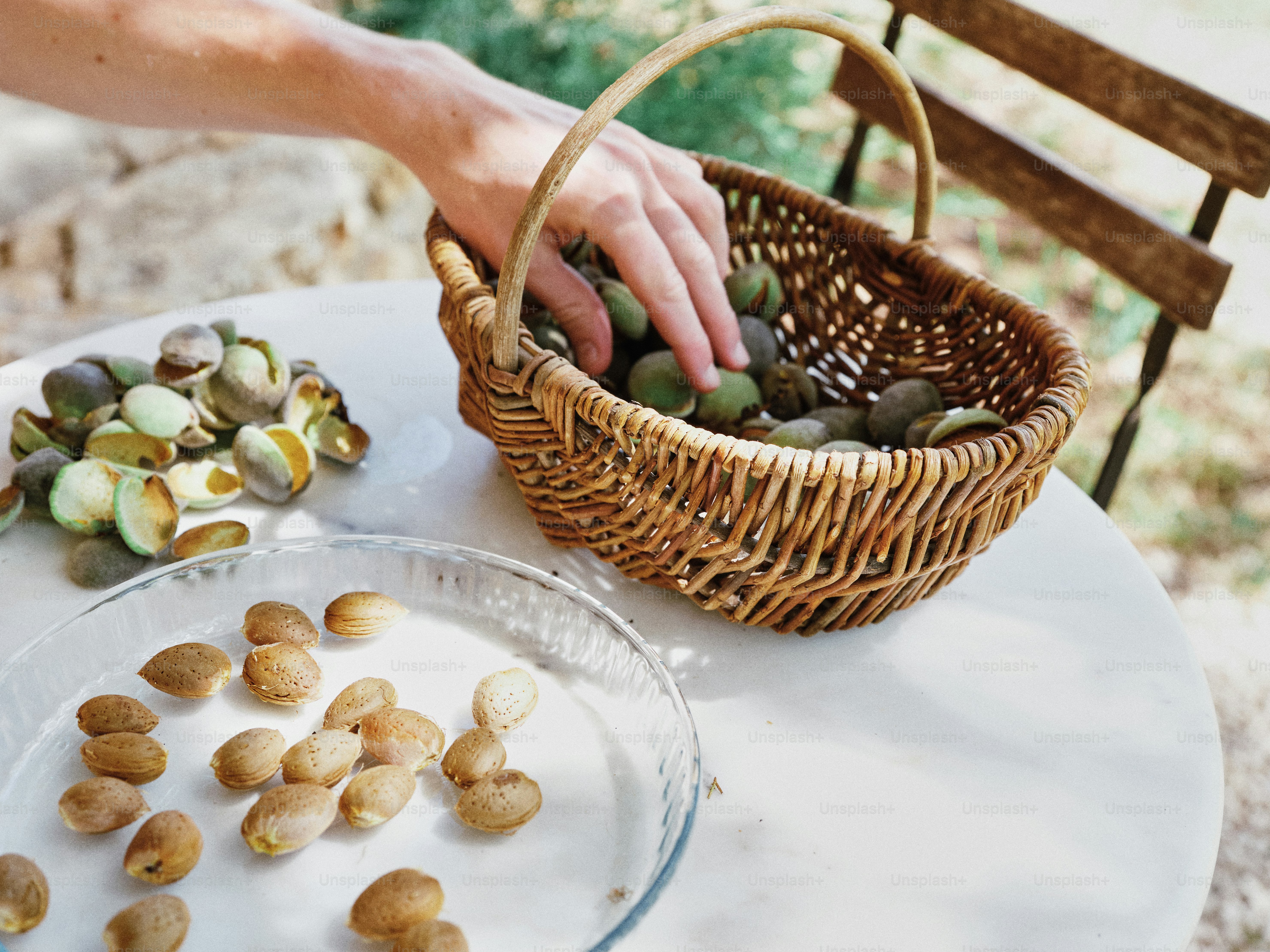 A person is picking nuts from a basket photo – Authentic Image on Unsplash