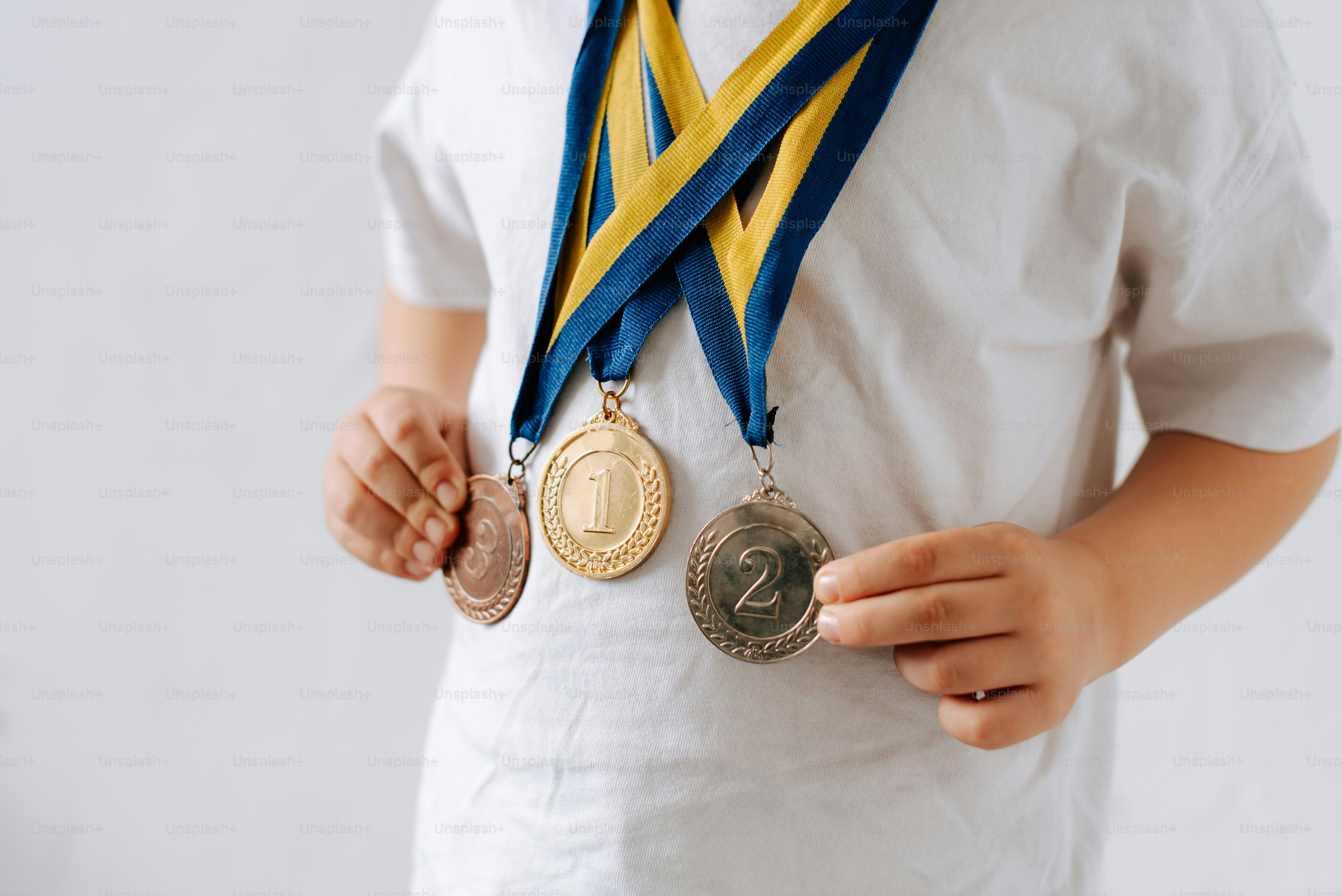 A bunch of medals that are on a table photo – Medals Image on Unsplash