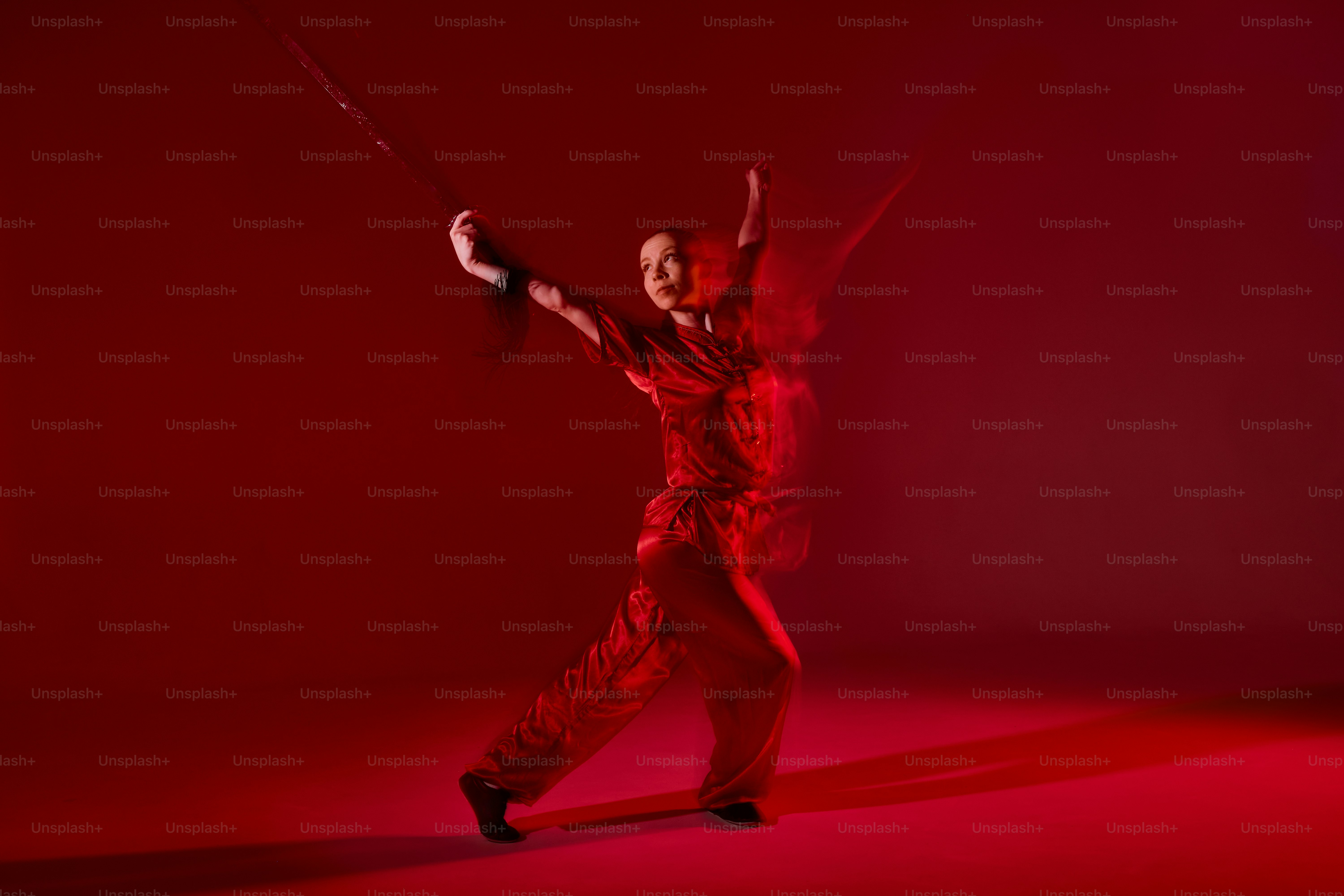 A man in a red outfit holding a baseball bat photo – Kung fu Image on ...