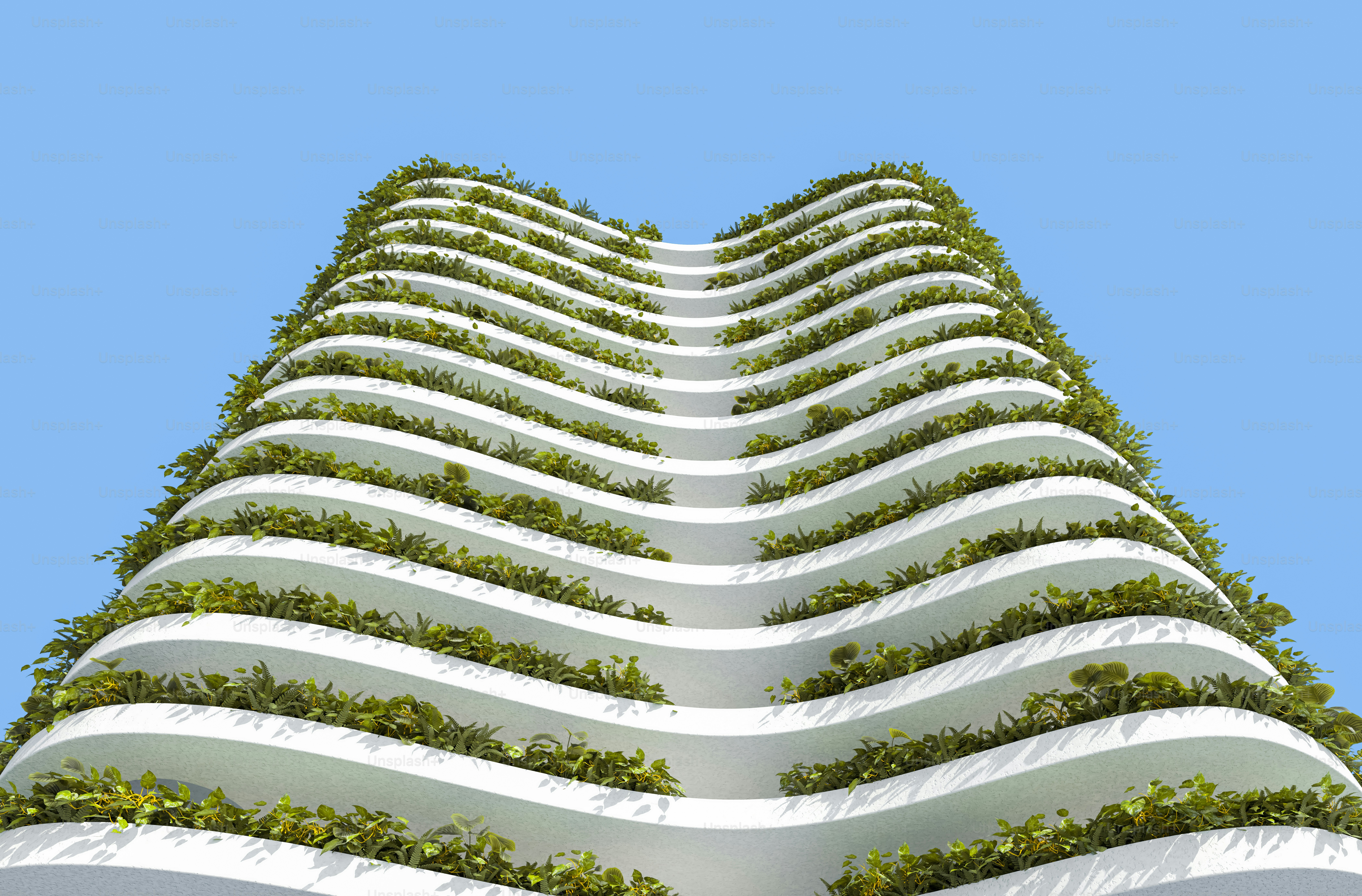 A very tall building with a bunch of flowers on it photo – Garden Image ...