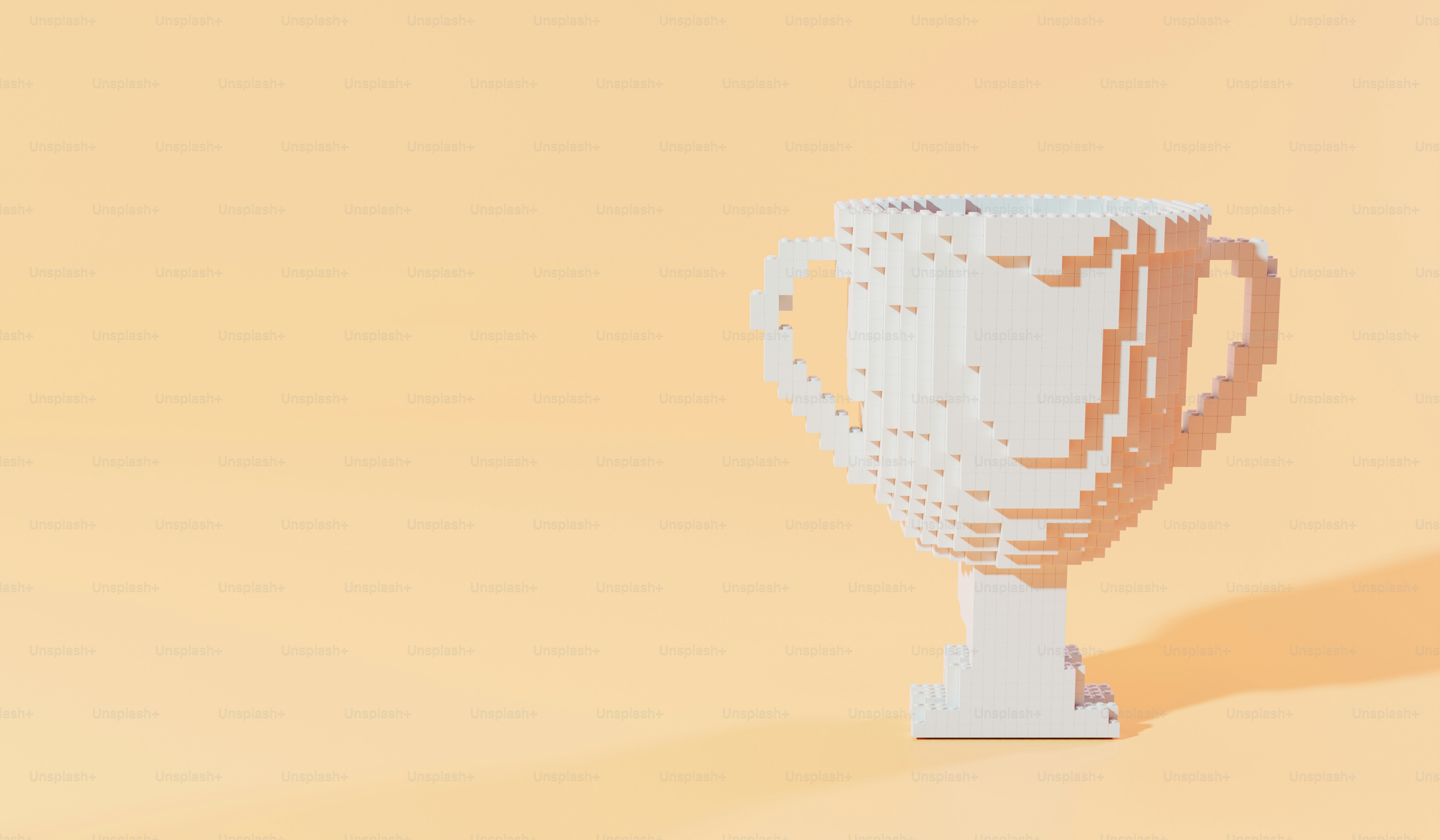 A cup made out of lego blocks on a yellow background photo – Silver cup ...