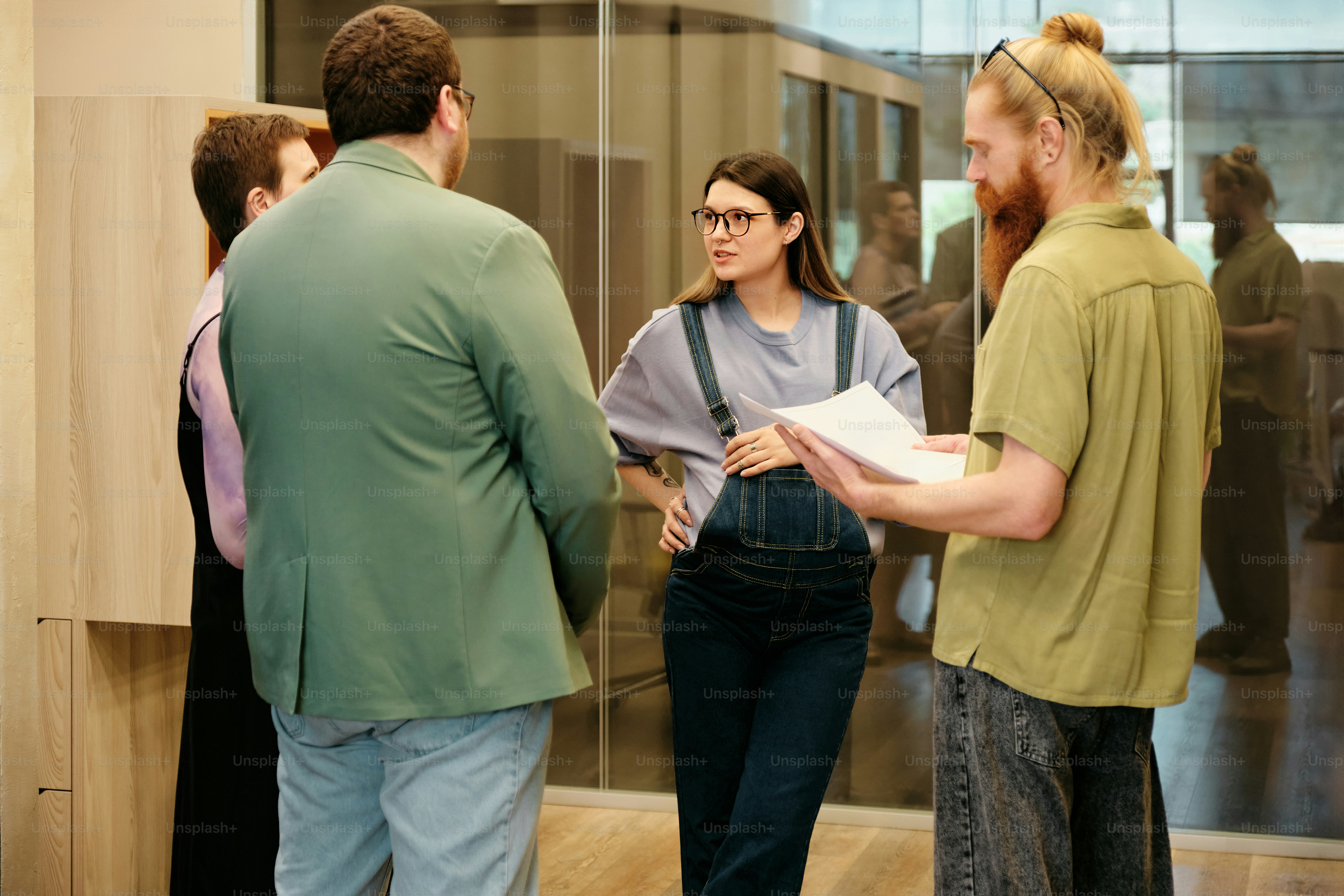 A group of people standing around a white board photo – Office Image on ...