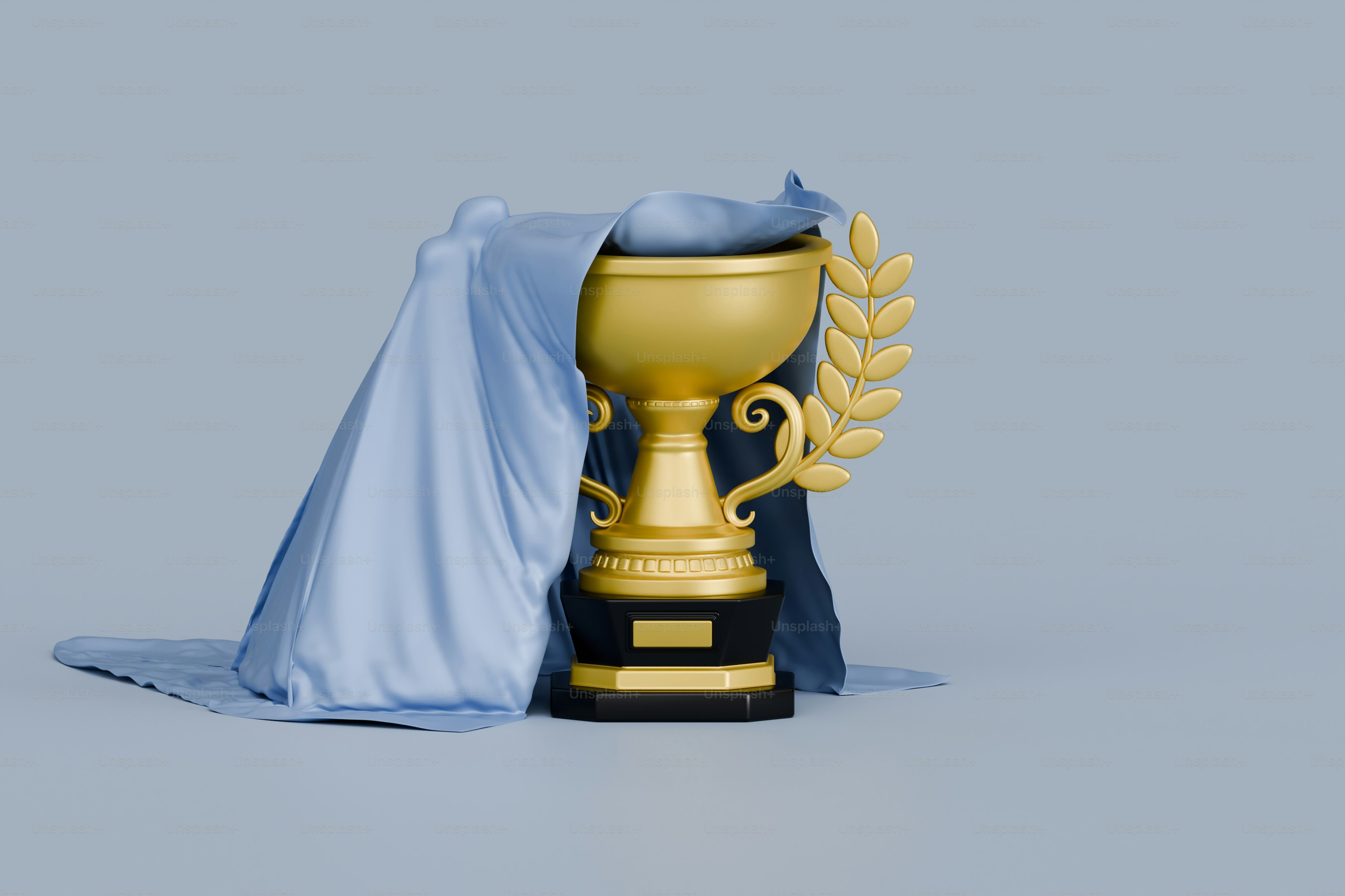 A golden trophy with a blue cloth draped around it photo – Winner Image ...