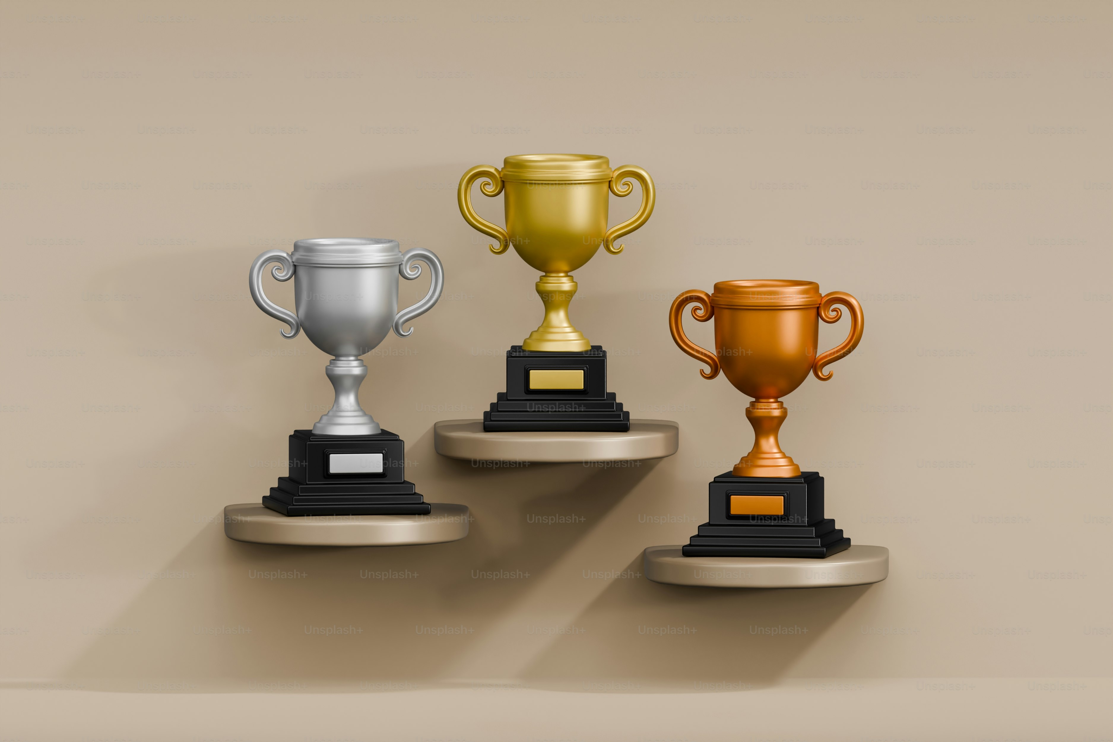 A row of three trophies sitting on top of each other photo – Prize ...