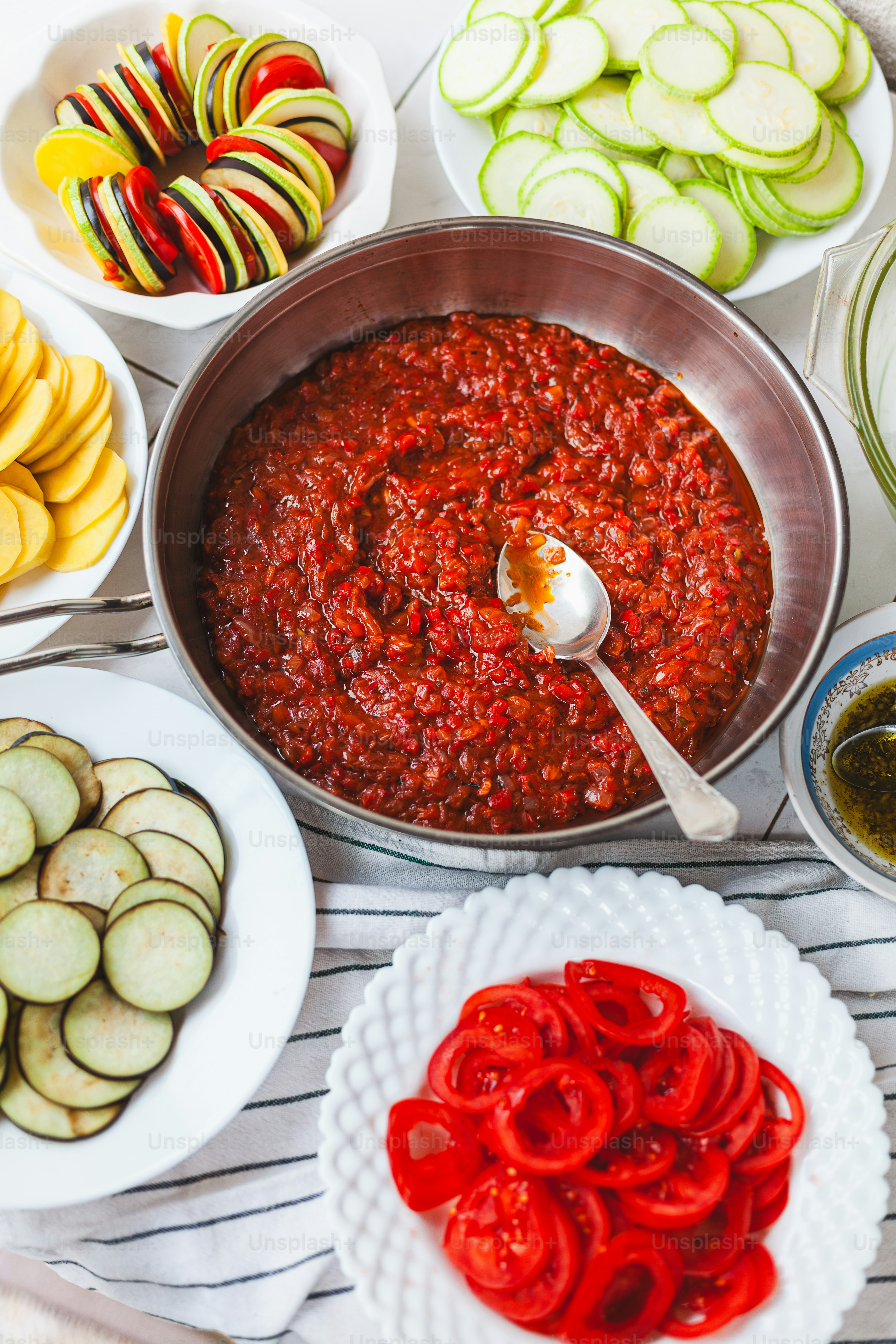 A table topped with lots of different types of food photo – Ratatouille ...
