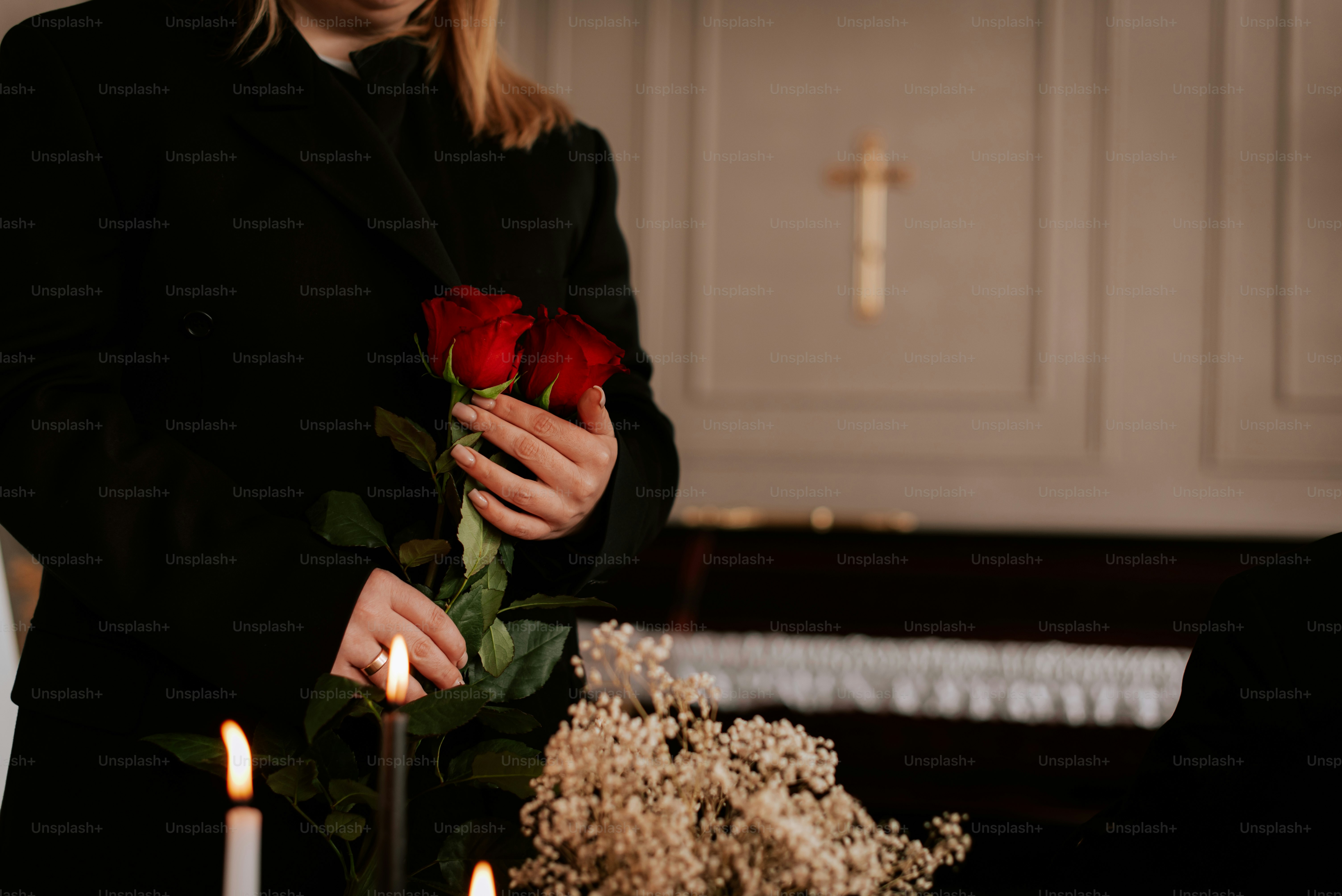 A woman is holding a rose in her hand photo – Death Image on Unsplash