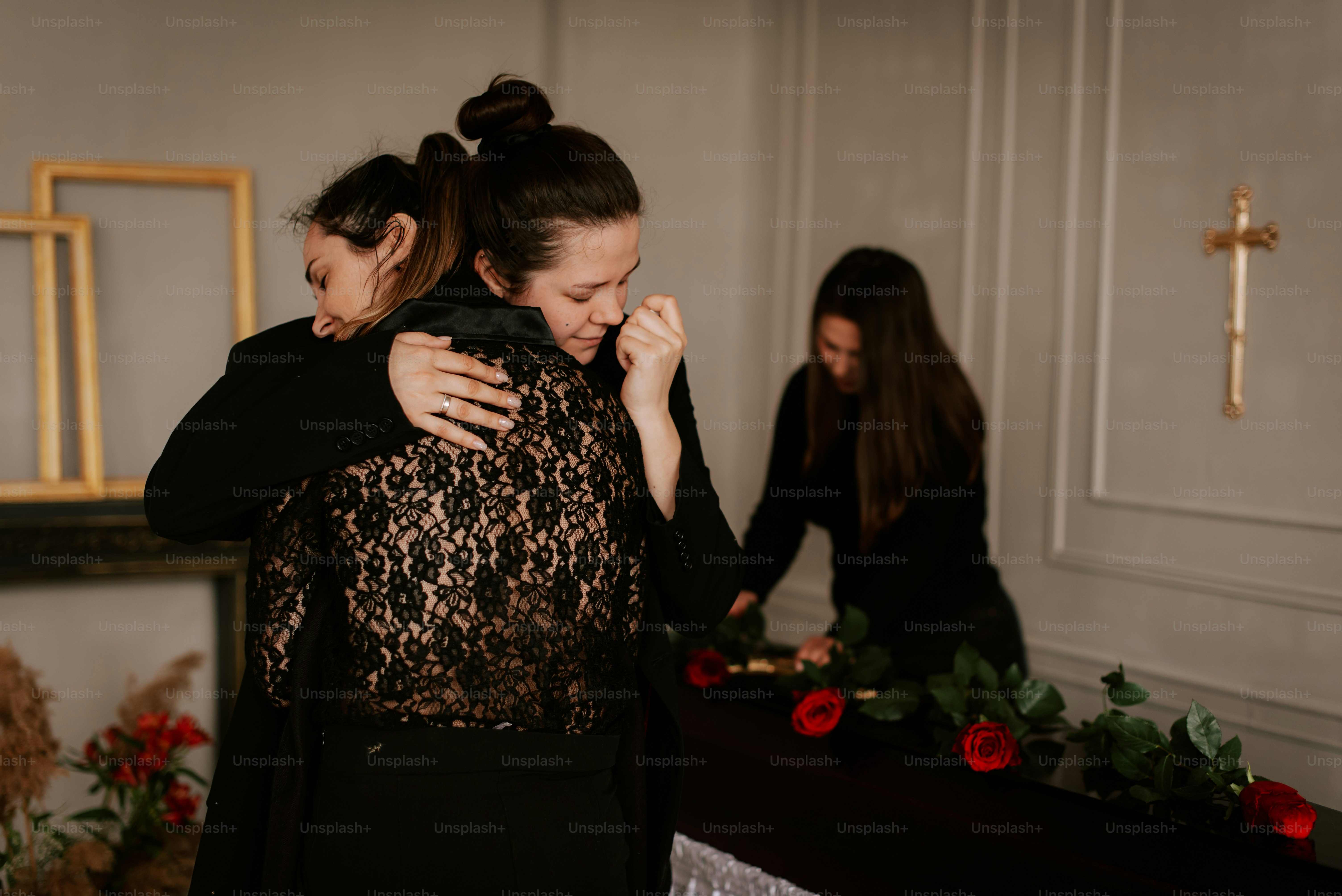 Two women hugging each other in a room photo – Death Image on Unsplash