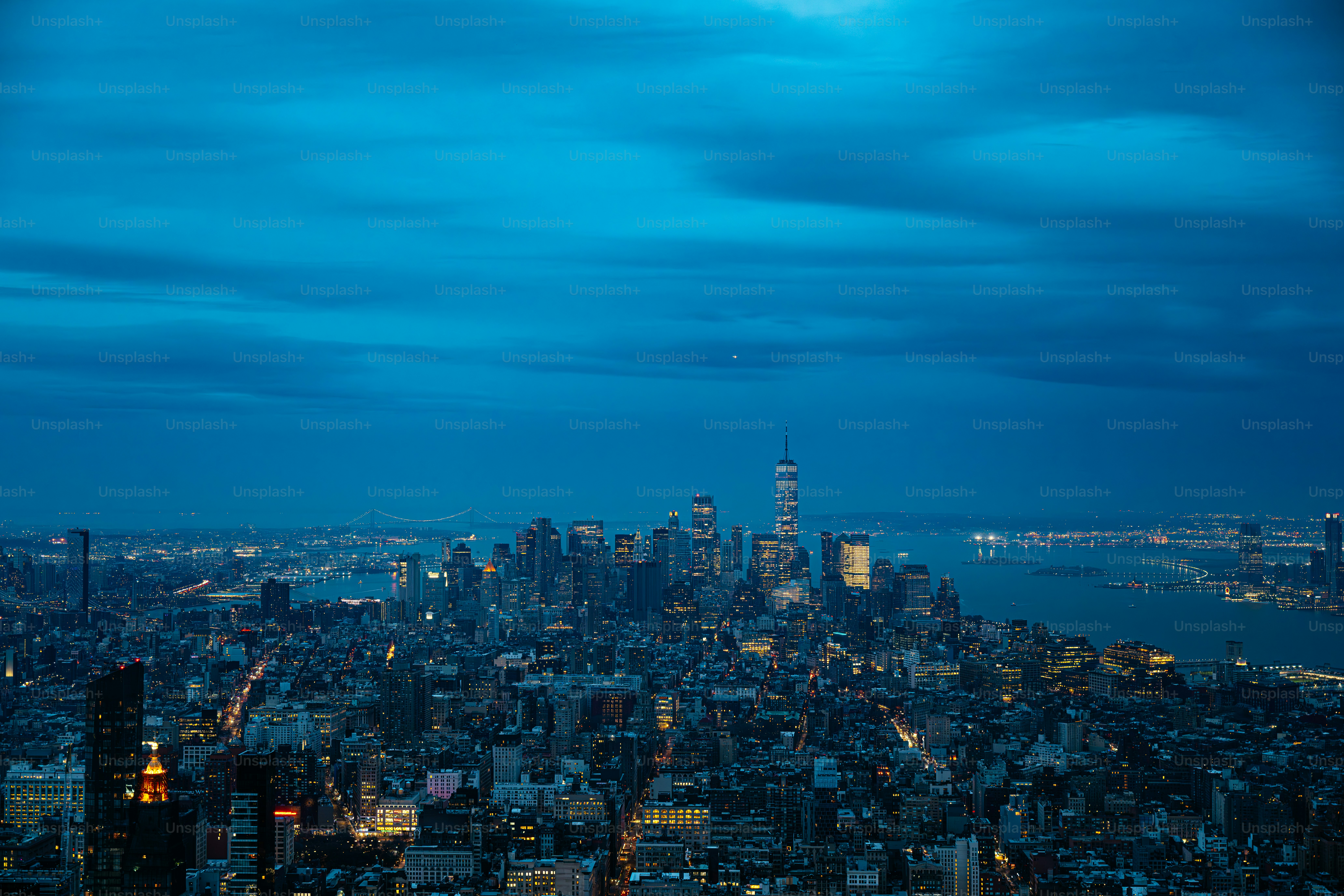 A view of a city at night from the top of a building photo – American ...