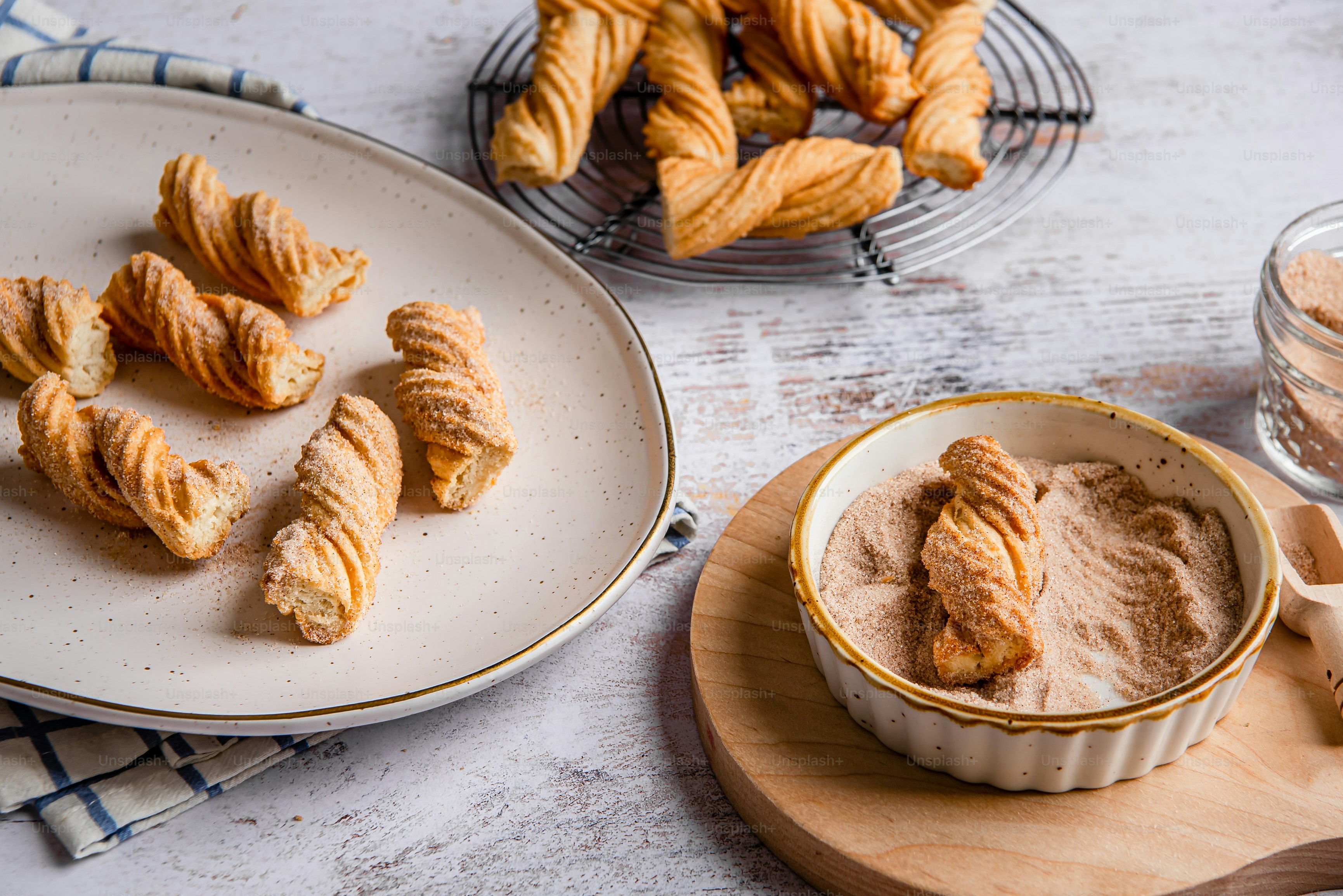 A plate of pastries and a bowl of powdered sugar photo – Food Image on ...