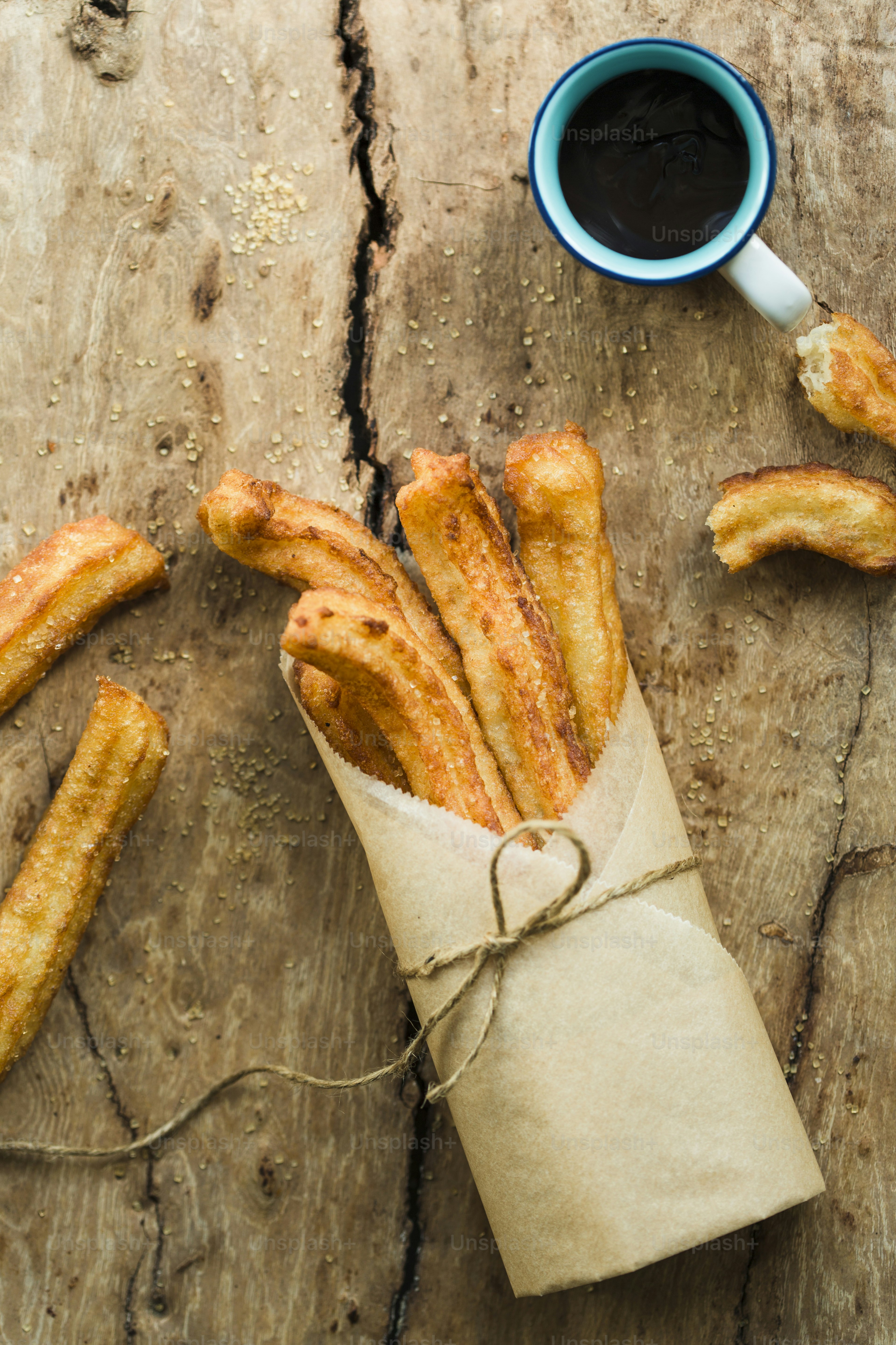 A bunch of french fries sitting on top of a wooden table photo – Sweet ...