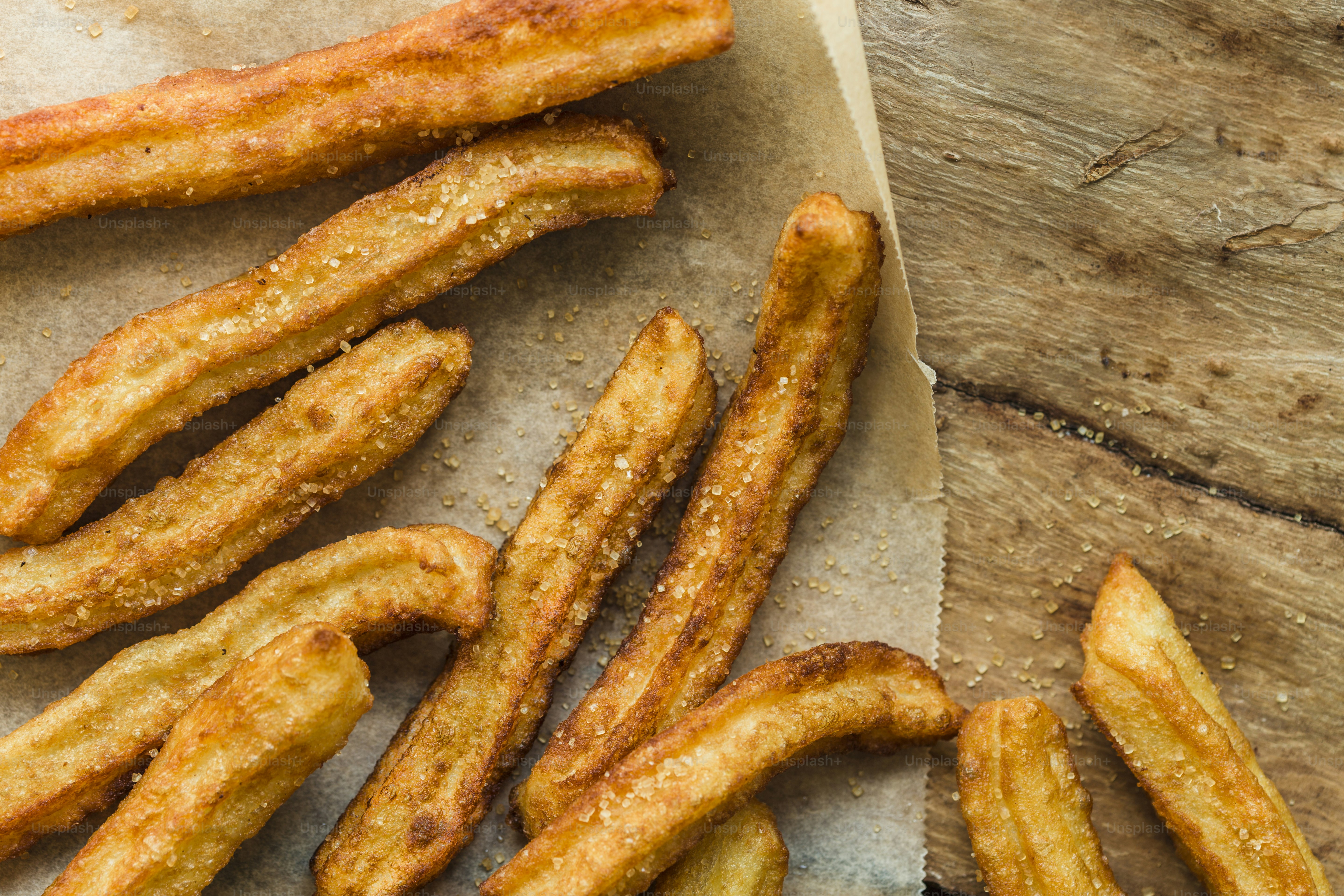 A bunch of fried food sitting on top of a piece of paper photo – Food ...
