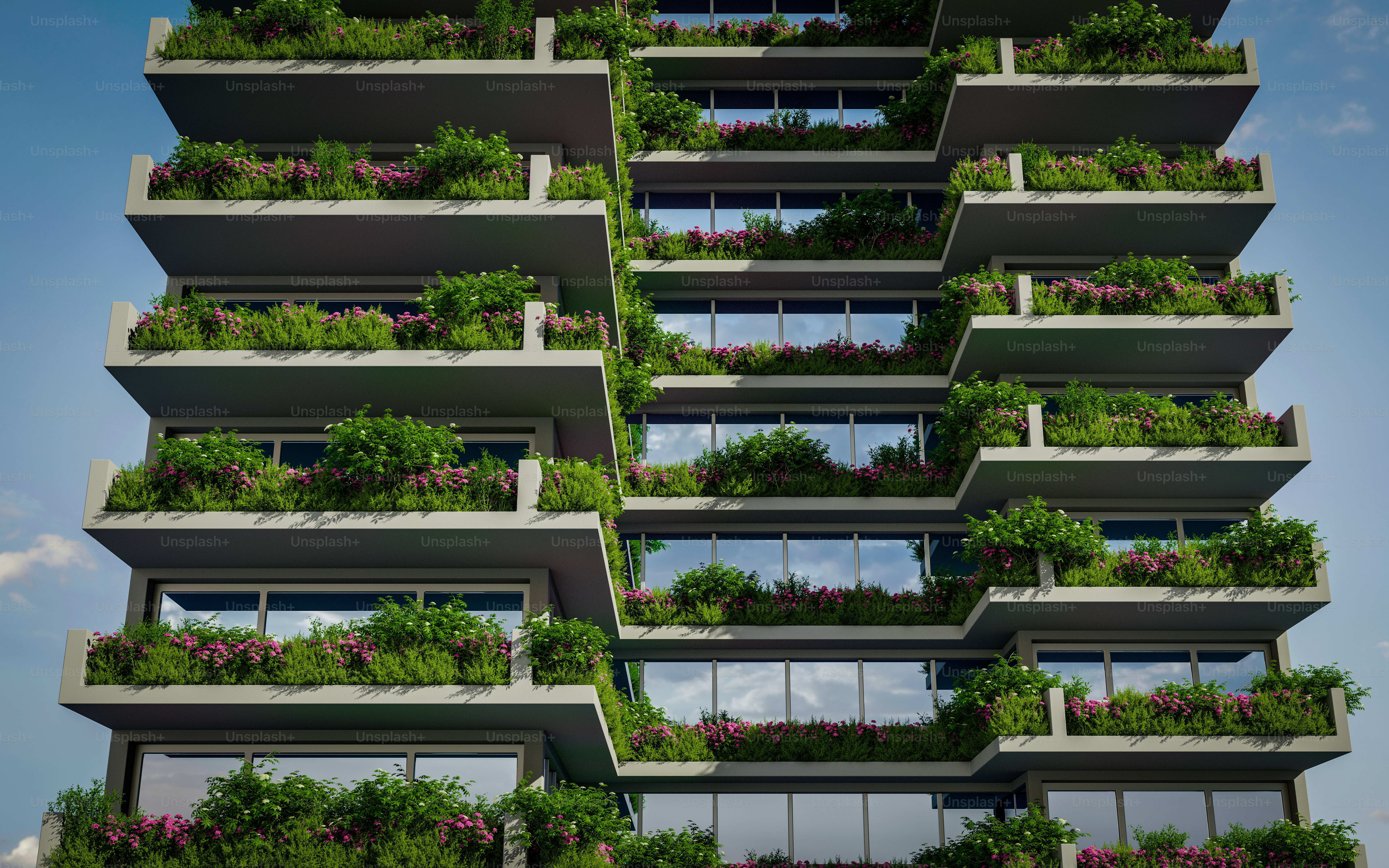 A very tall building with a bunch of plants on it photo – High rise ...