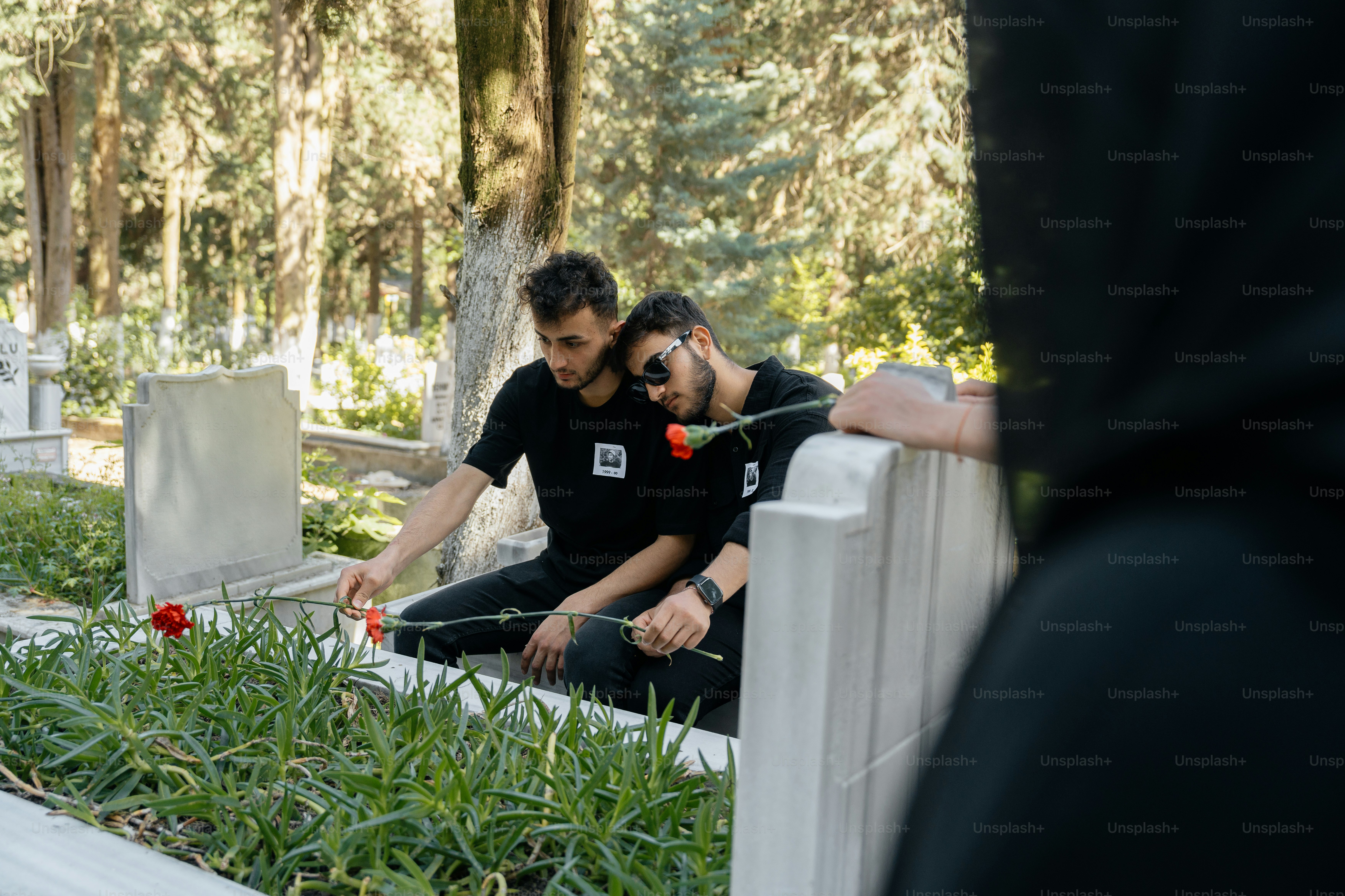 A couple of men sitting next to each other photo – Coffin Image on Unsplash