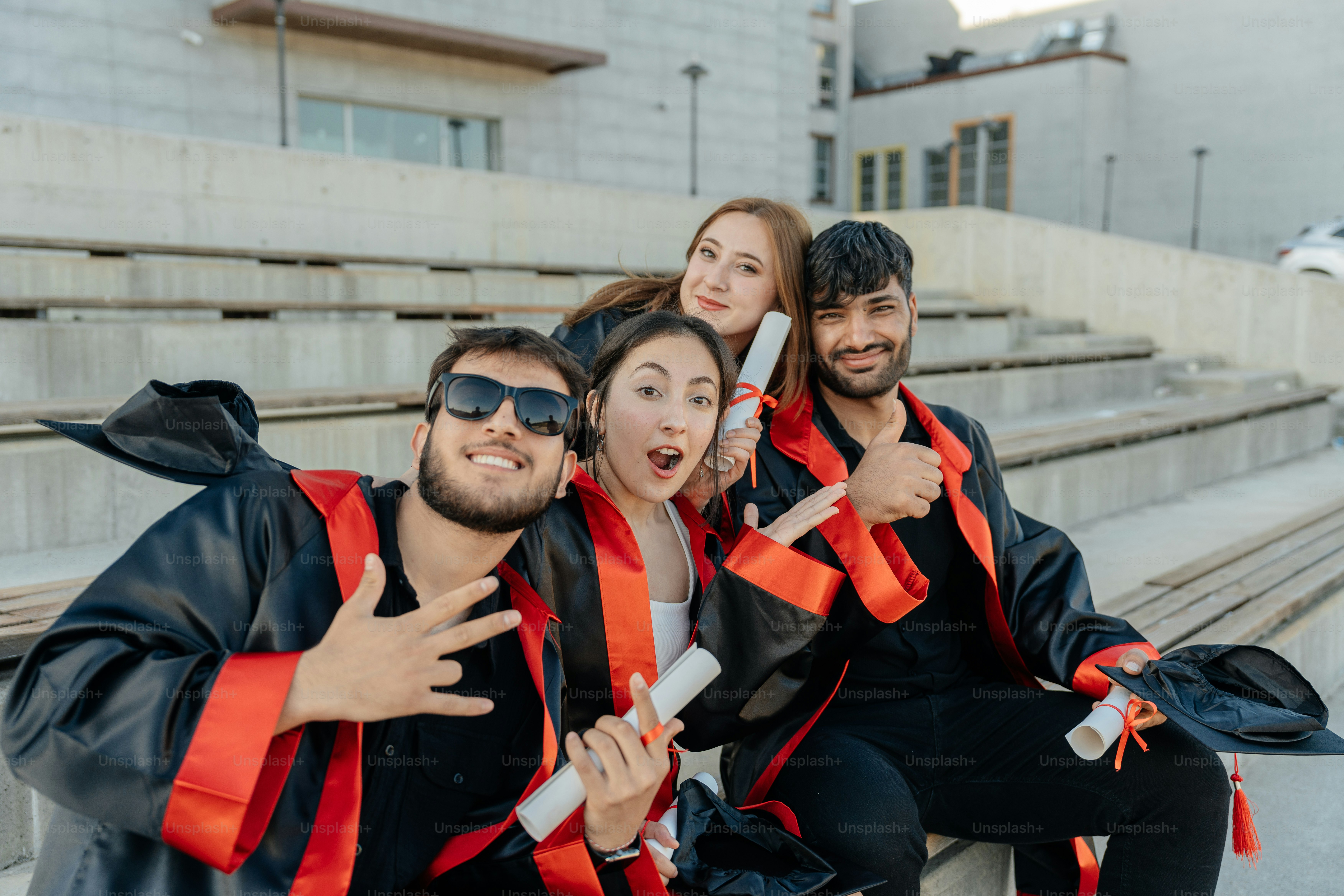 A group of men standing on top of a stair case photo – College ...