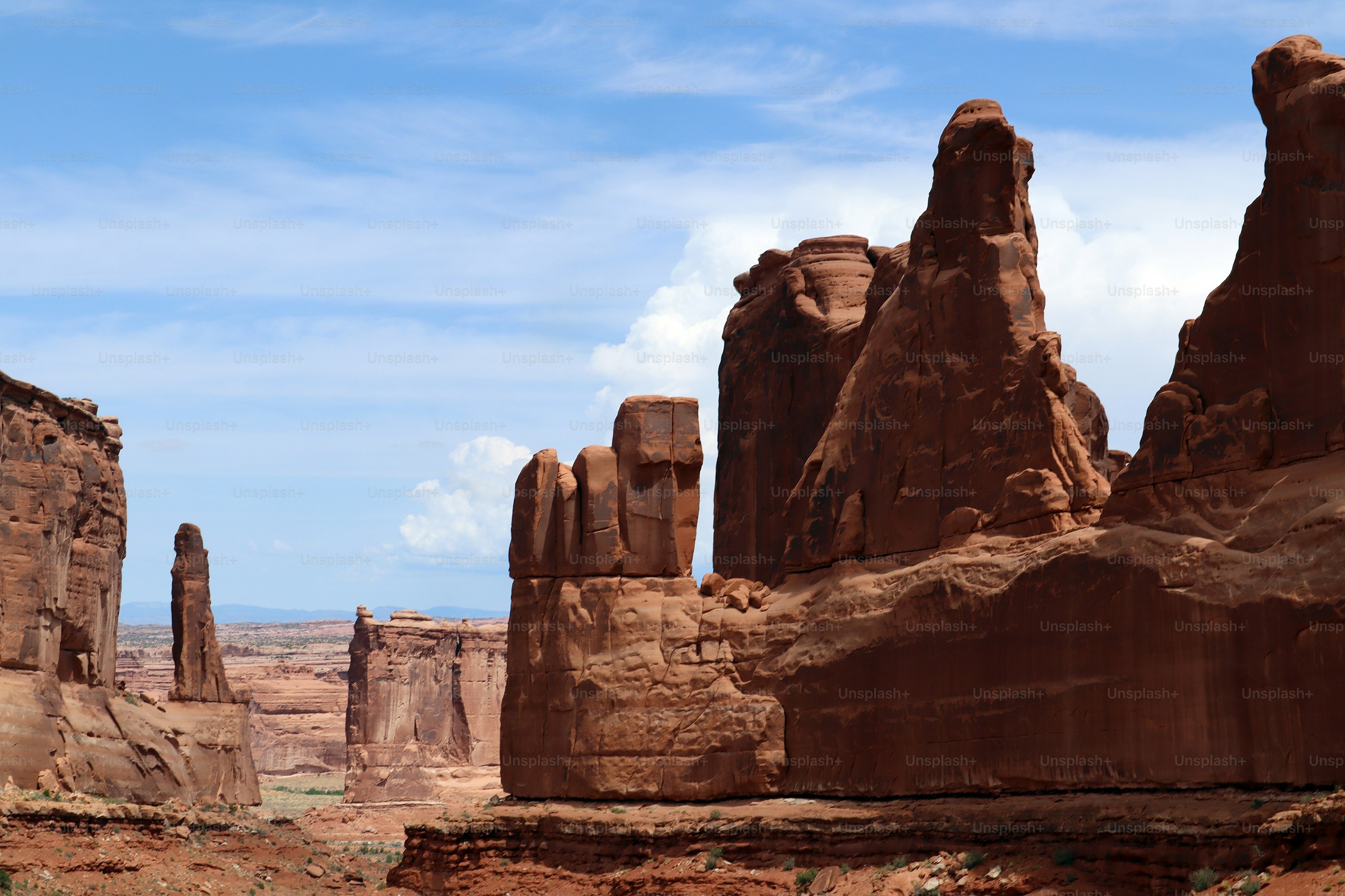 A large rock formation in the middle of a desert photo – Scenery Image ...