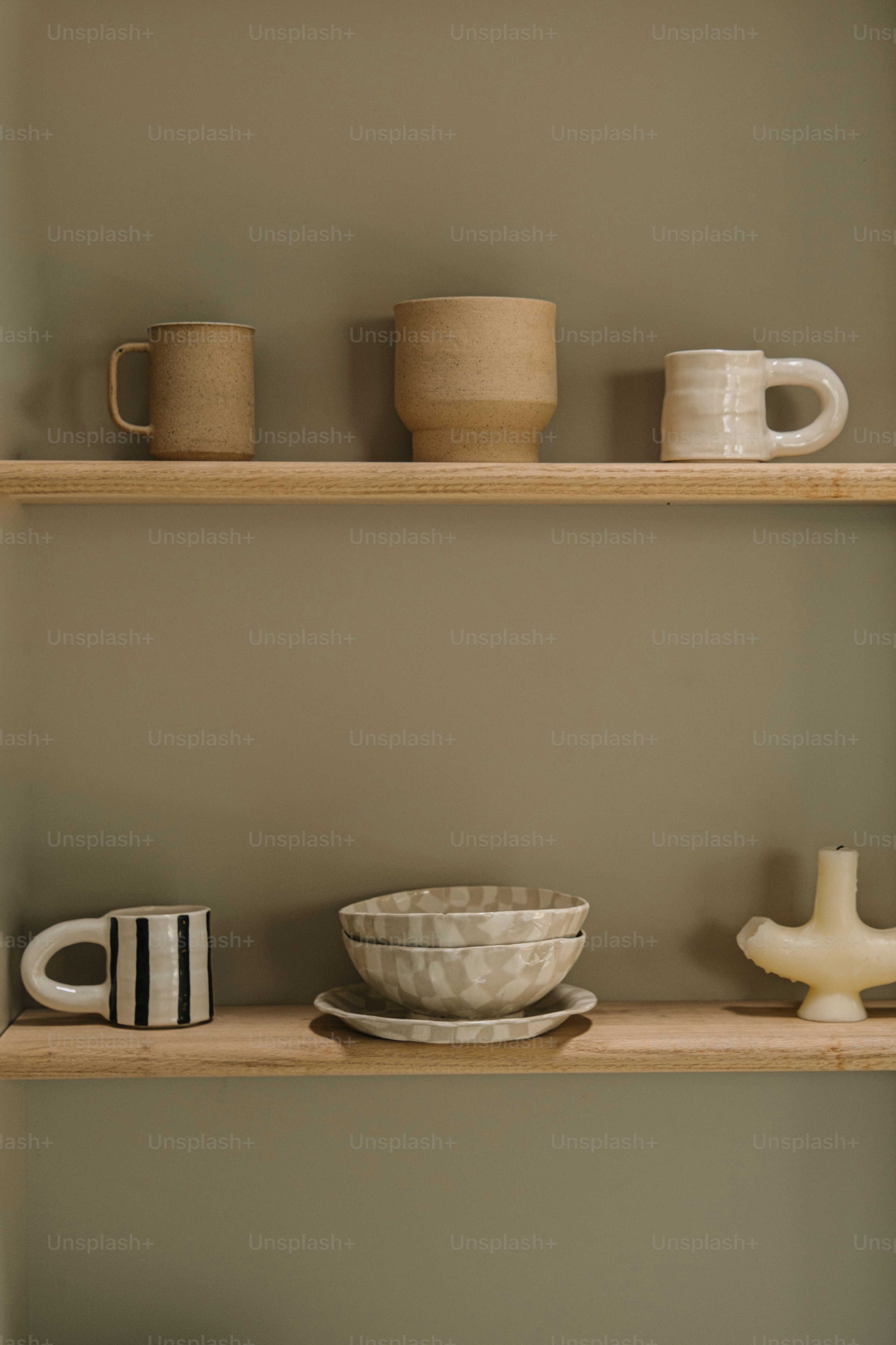 A couple of shelves that have some cups on them photo – Shelves Image ...