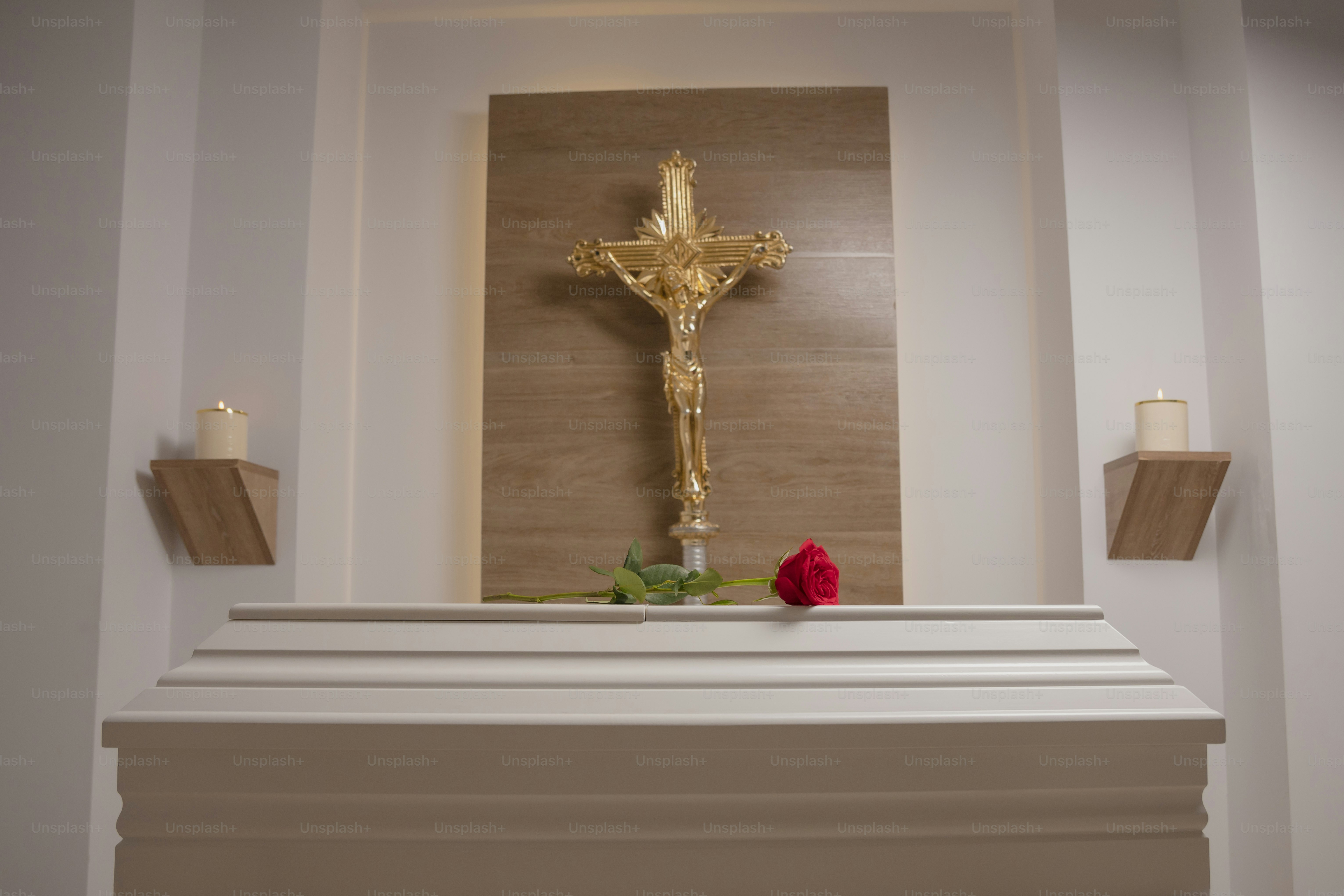 A cross and a rose on a mantle in a church photo – Crucifix Image on ...