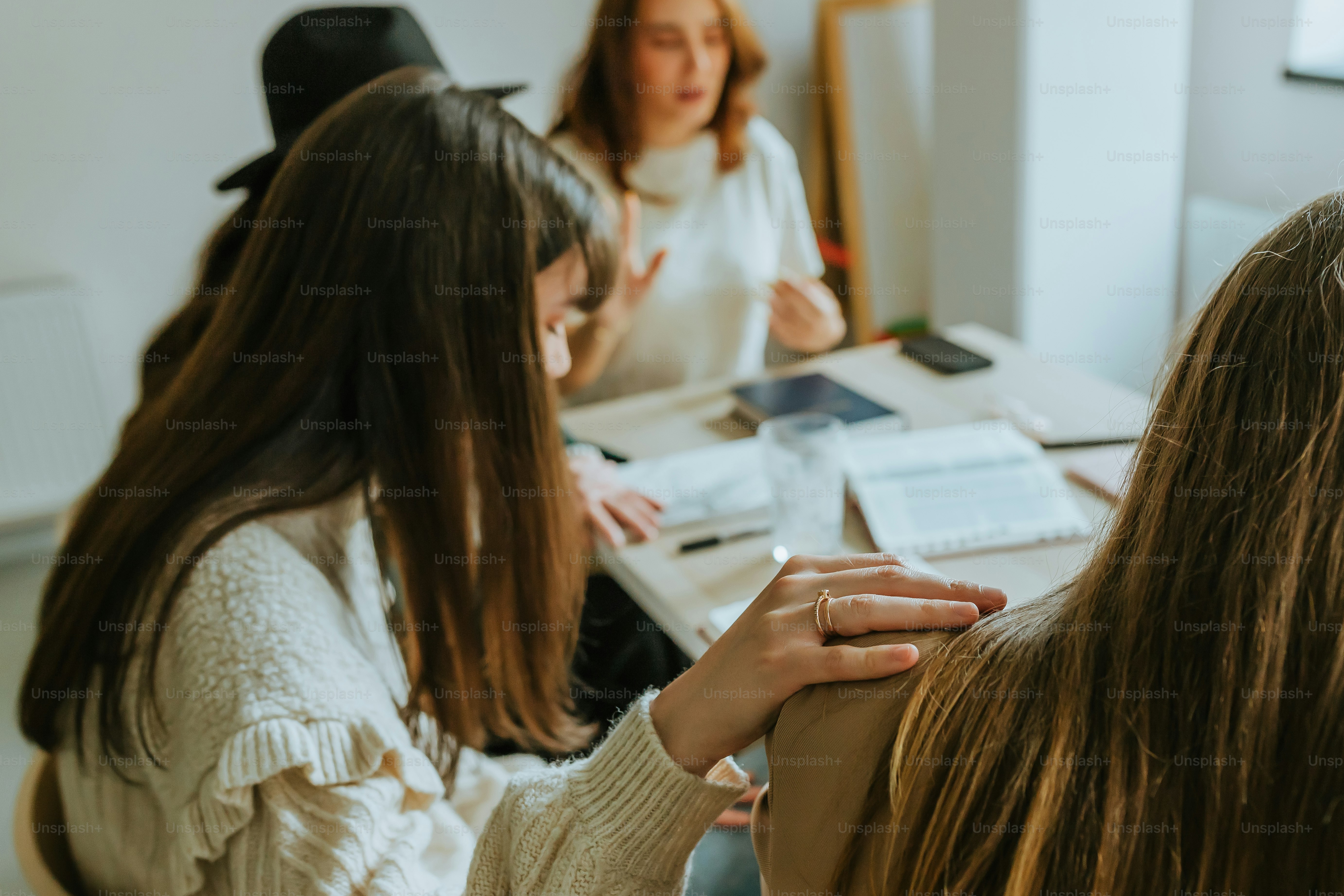A group of women sitting around a table photo – Bible reading Image on ...