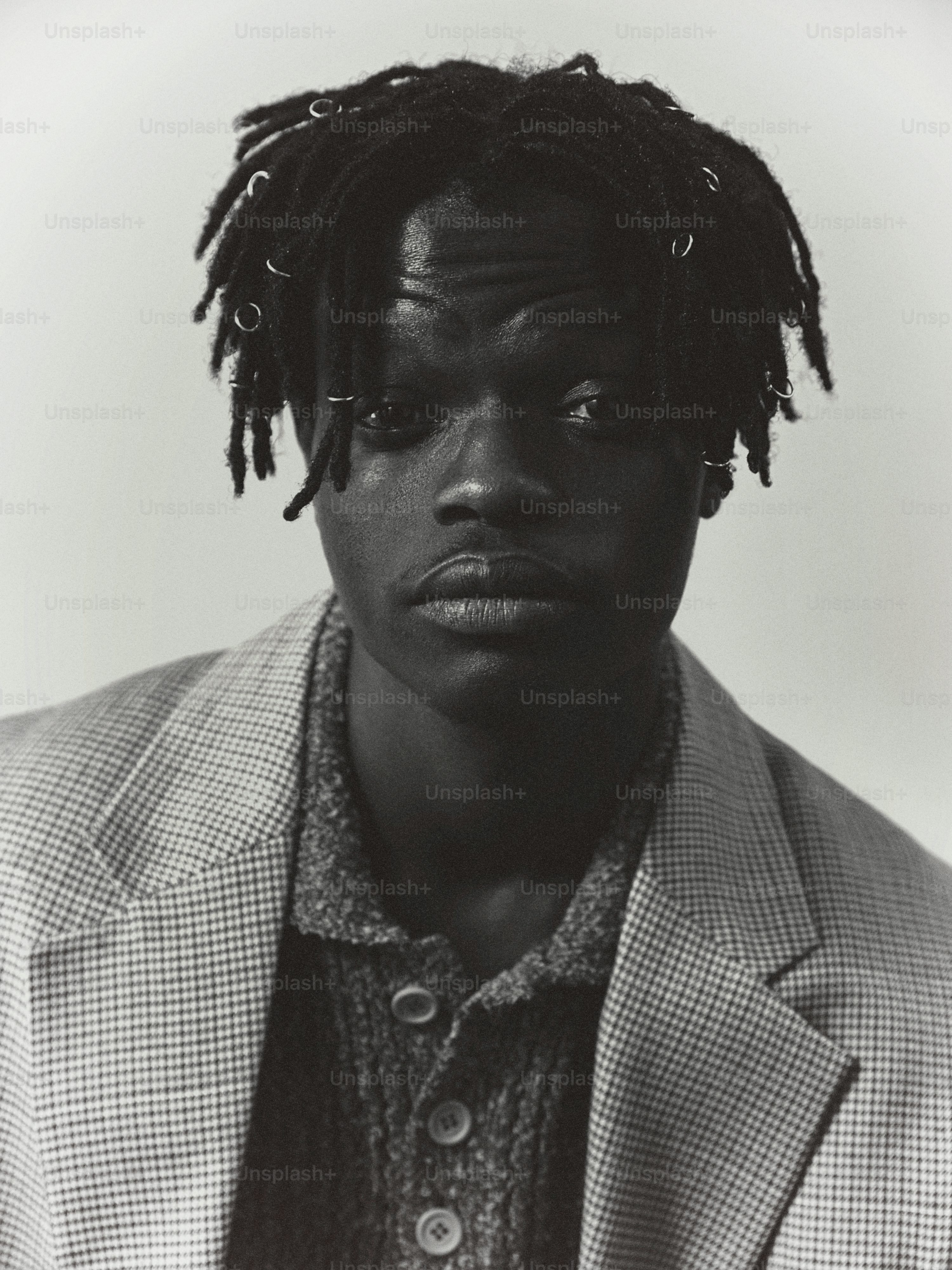 A man with dreadlocks wearing a suit and a necklace photo – Jacket ... A man with dreadlocks wearing a suit and a necklace photo – Jacket ...