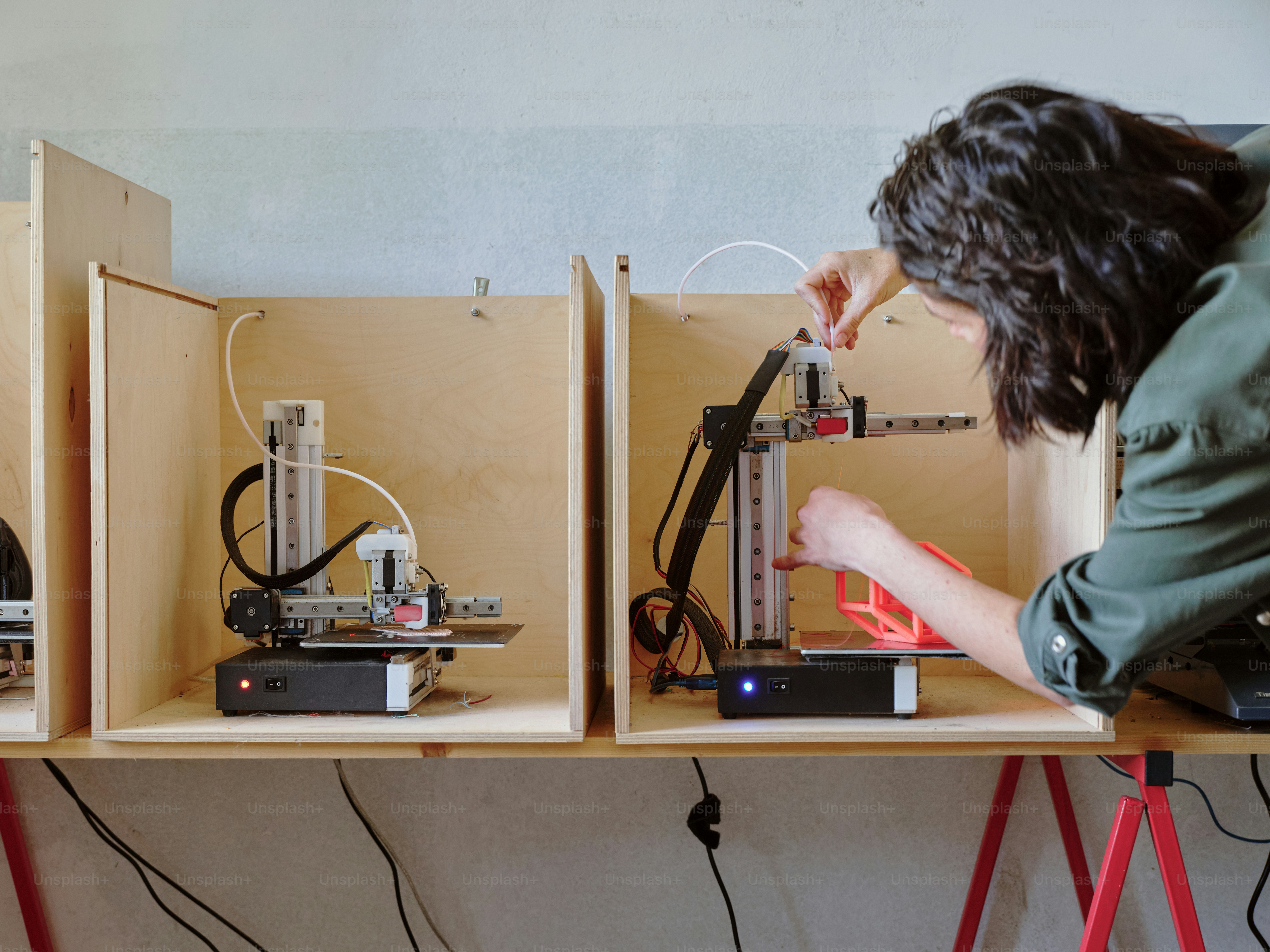 A woman is working on a project in a box photo – 3d printing Image on ...