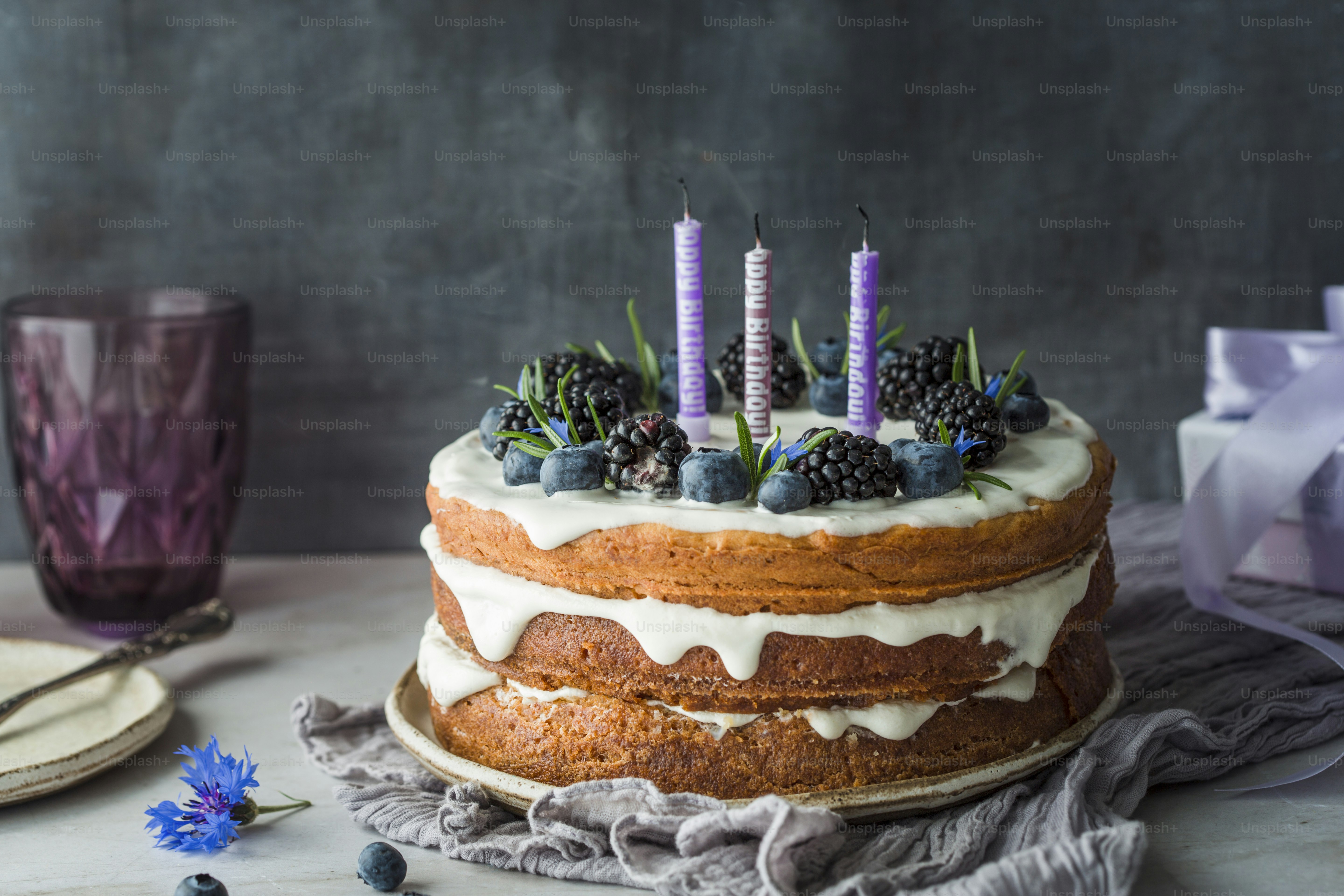 A cake with blueberries and candles on top of it photo – Cakes Image on ...