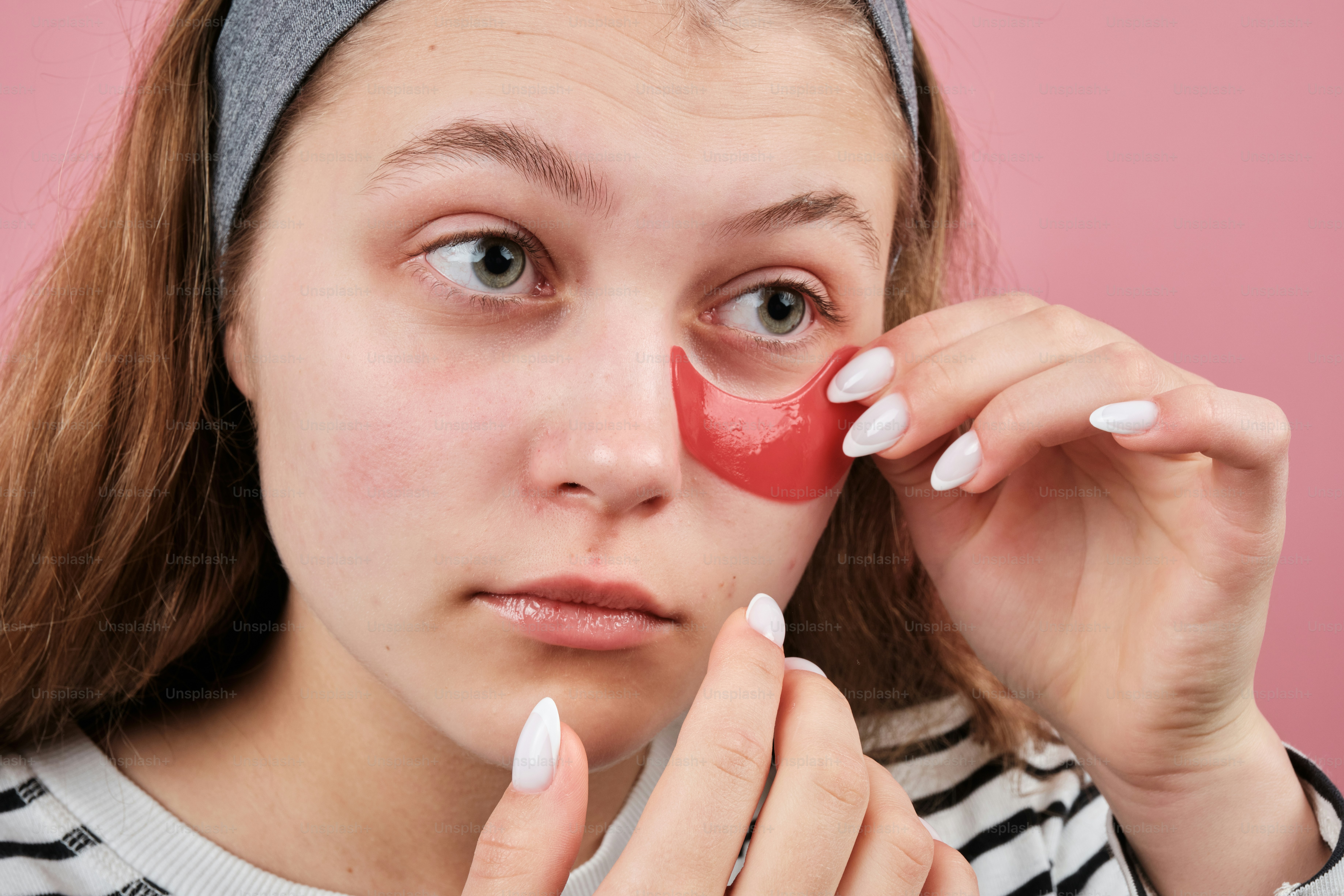 A woman with a red eye patch on her face photo – Health Image on Unsplash