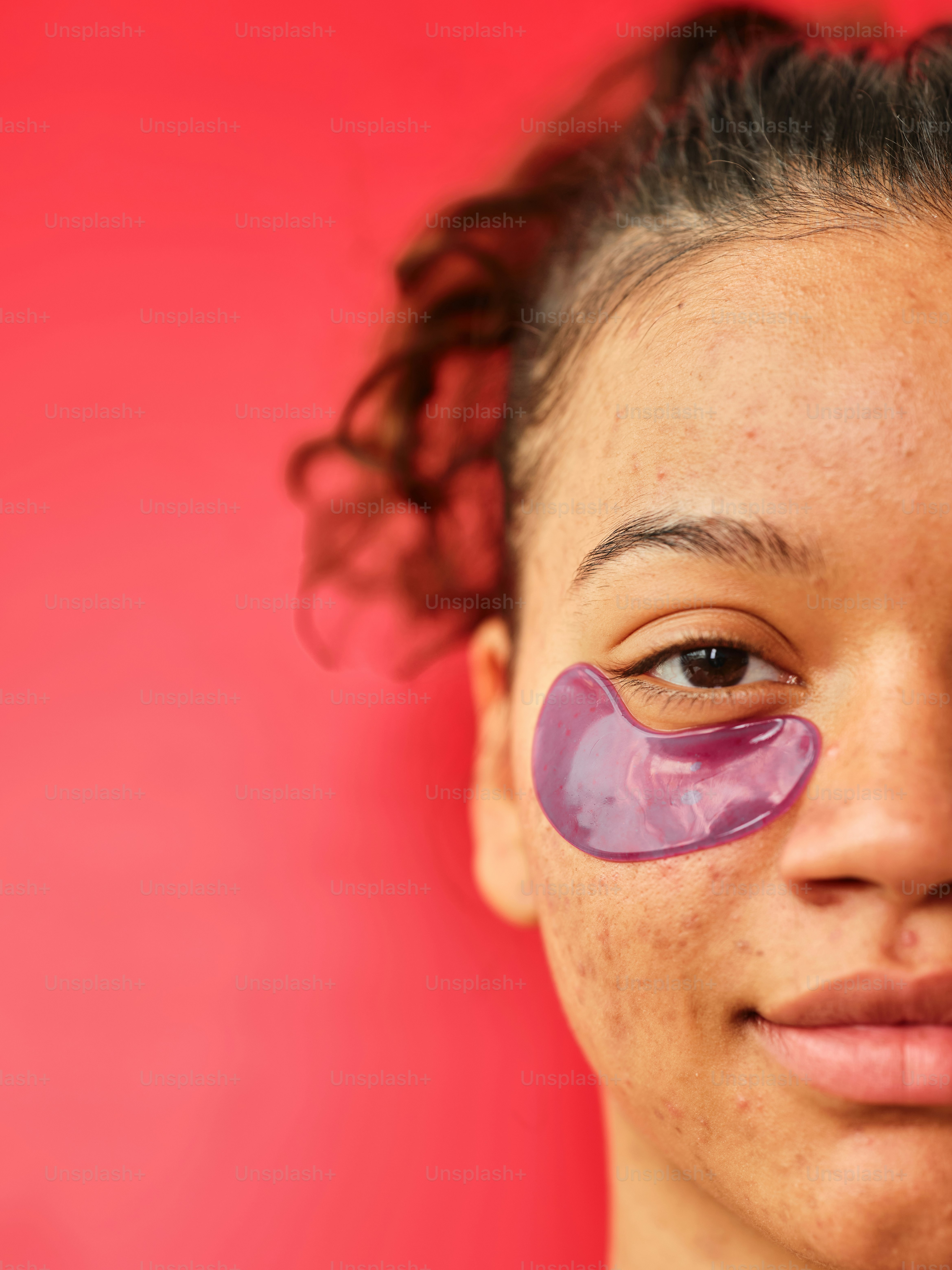 A woman with a purple eye patch on her face photo – Teenage girl Image ...