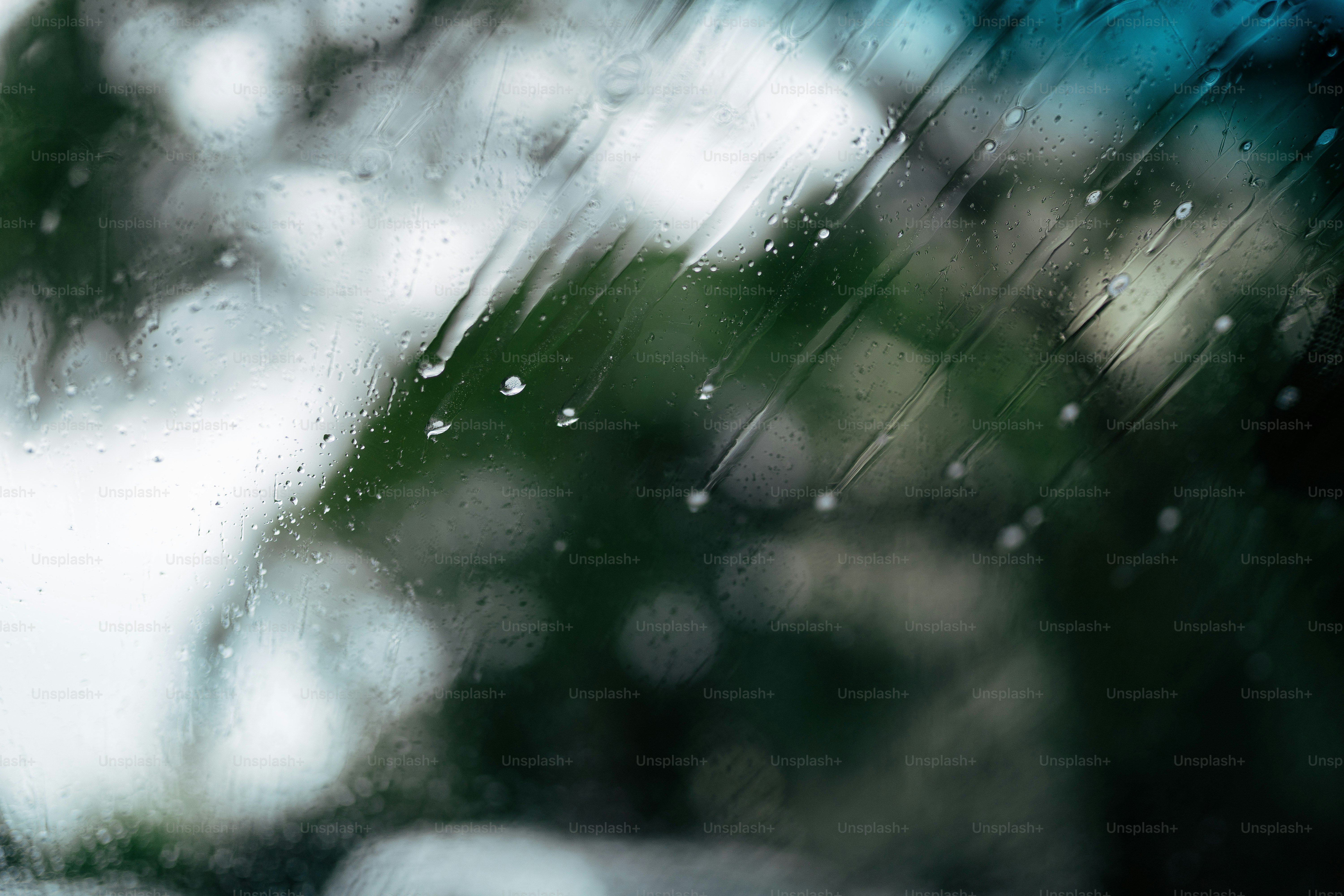 A window with rain drops on it photo – Bokeh Image on Unsplash