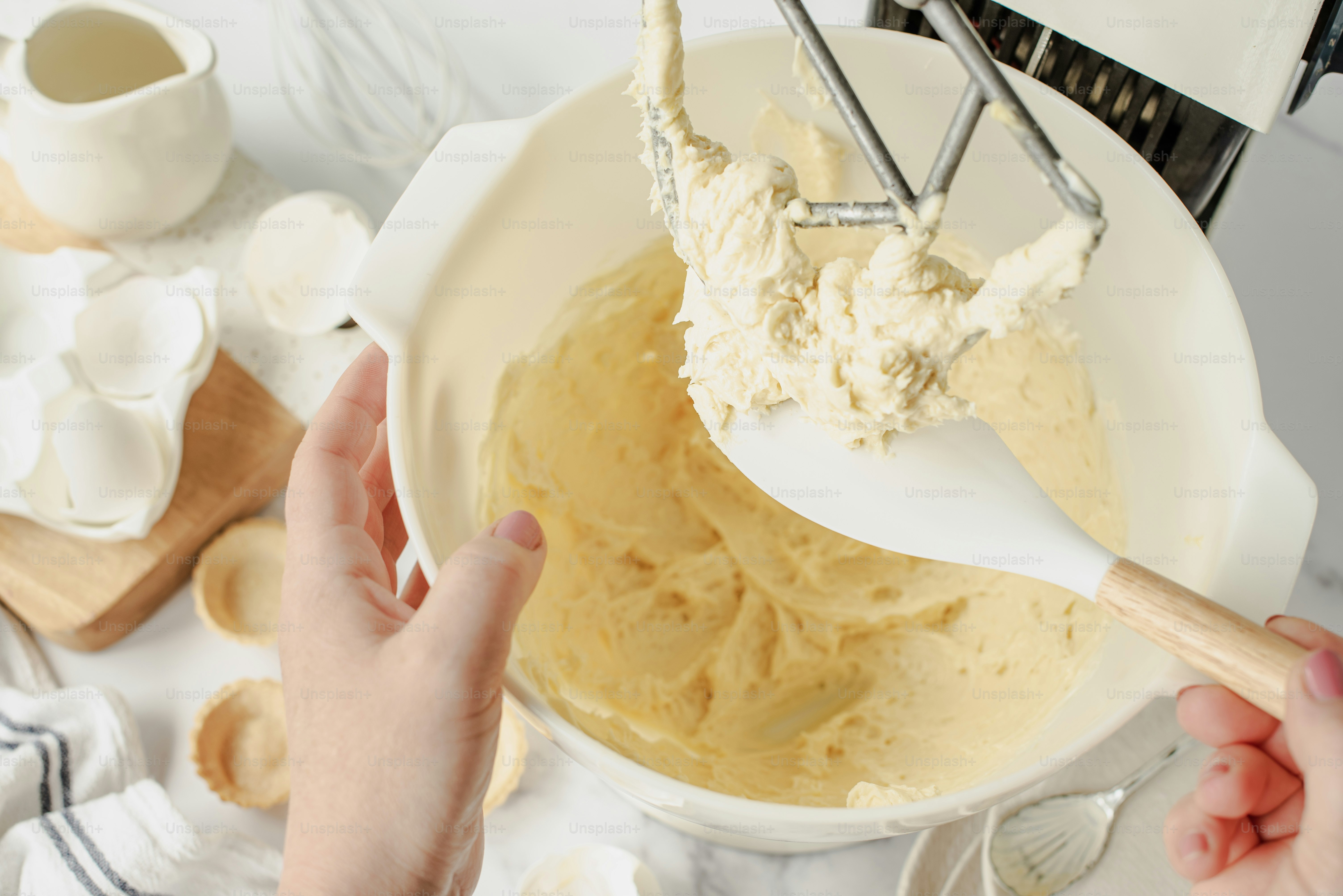 A person mixing batter in a white bowl photo – Mixer Image on Unsplash