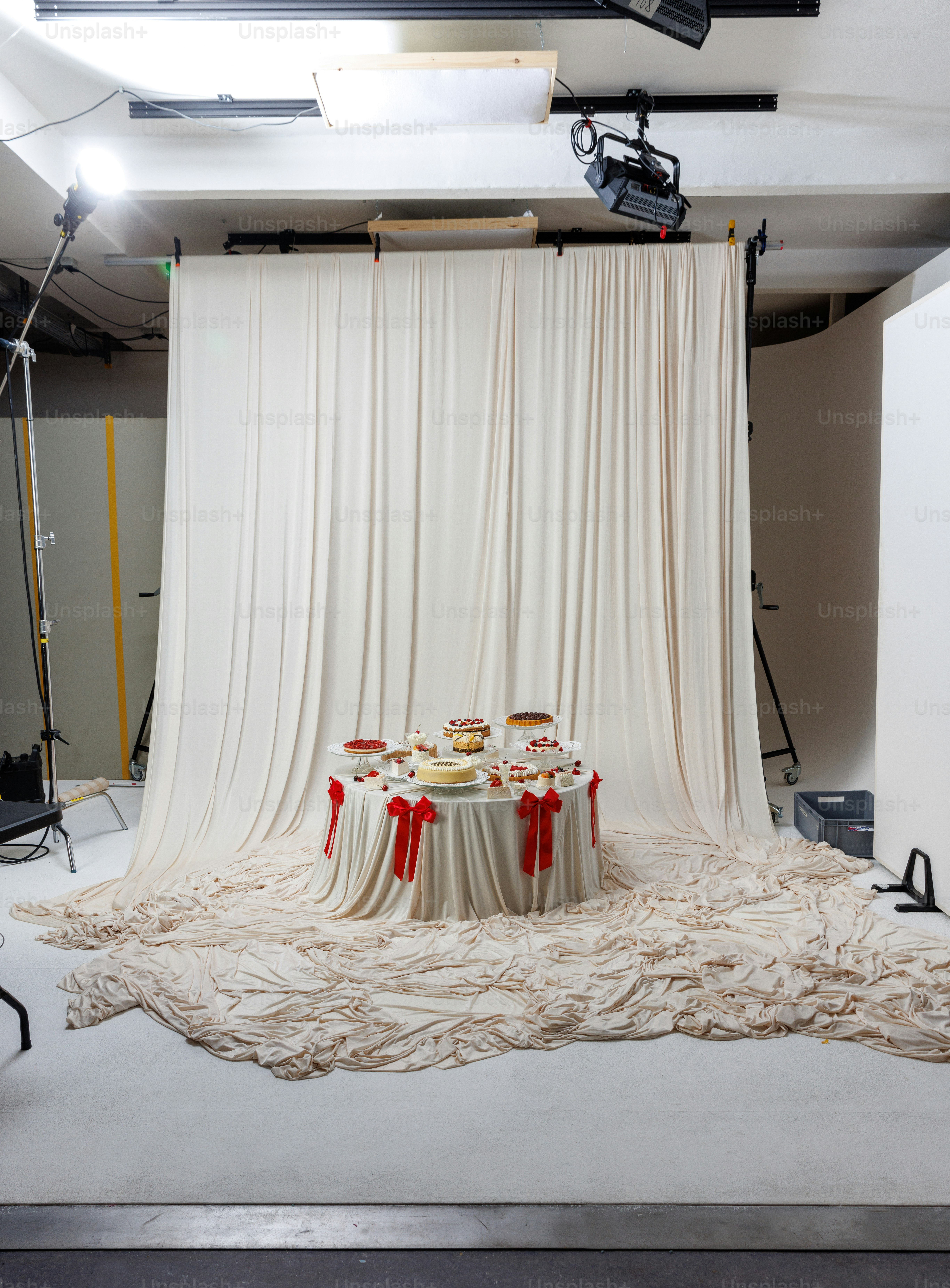 A photo shoot of a table with cupcakes on it photo – Cakes Image on ...