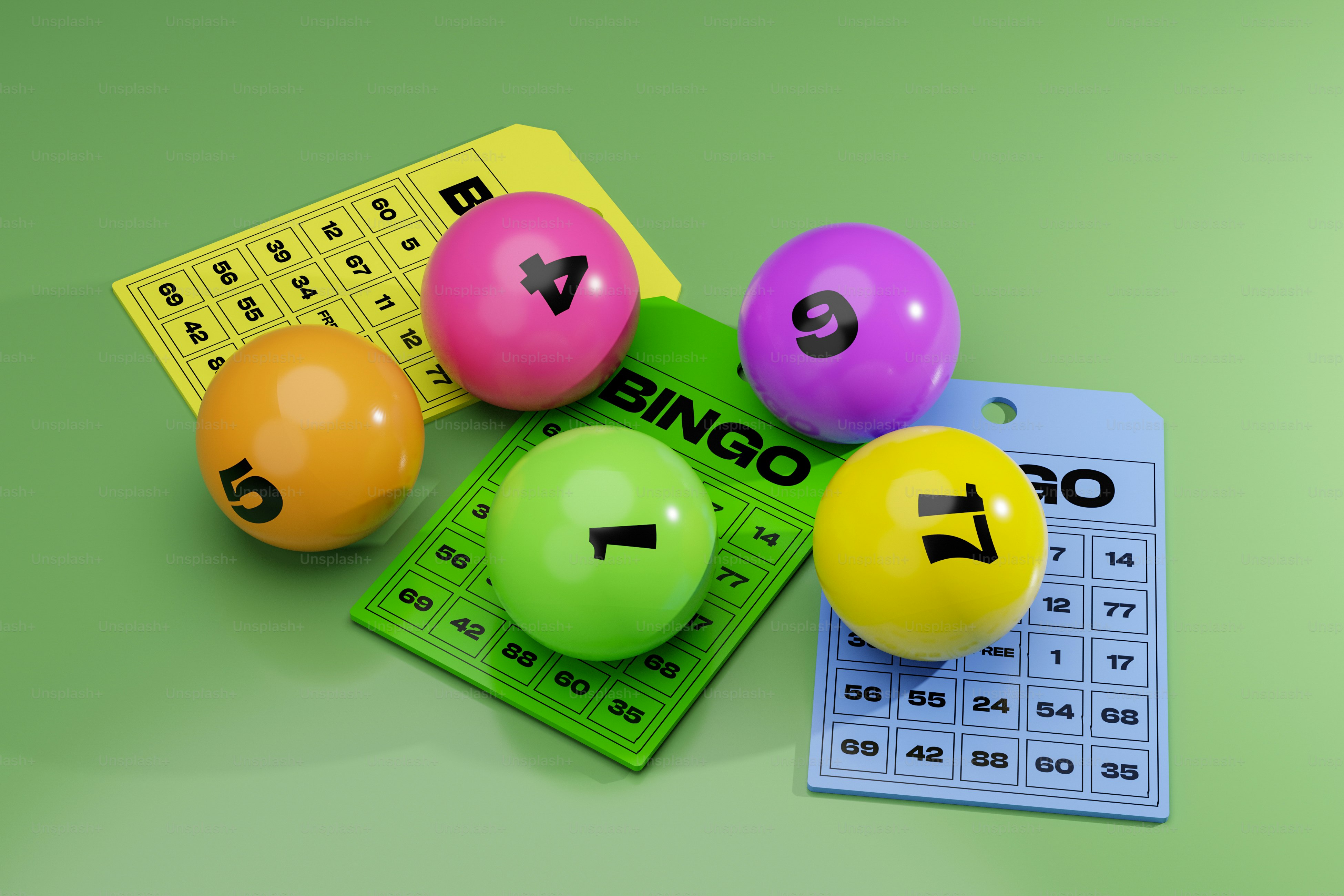 A group of colorful balls sitting on top of a table photo – Bingo Image ...