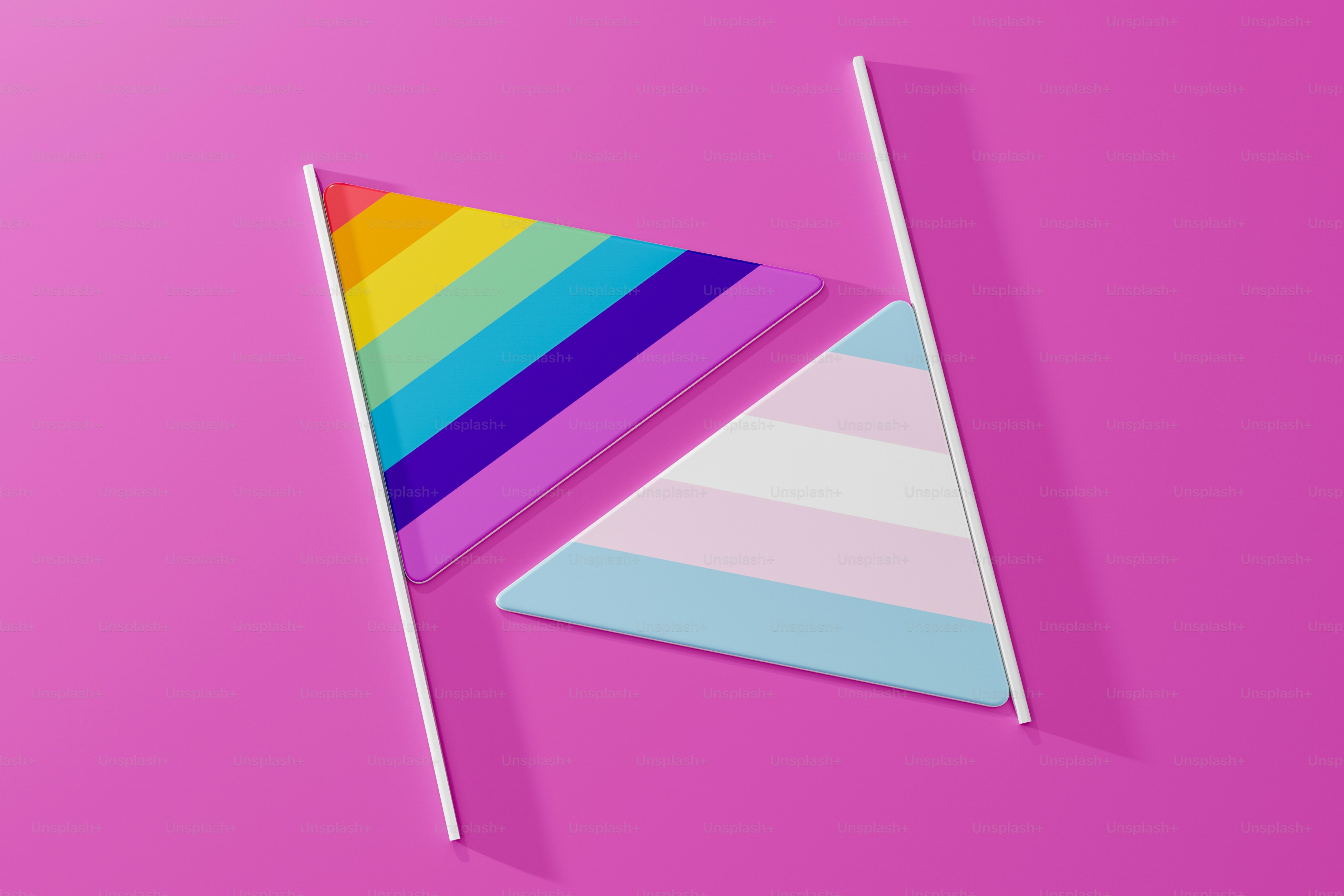 A rainbow colored triangle on a pink background photo – Pride flag ...