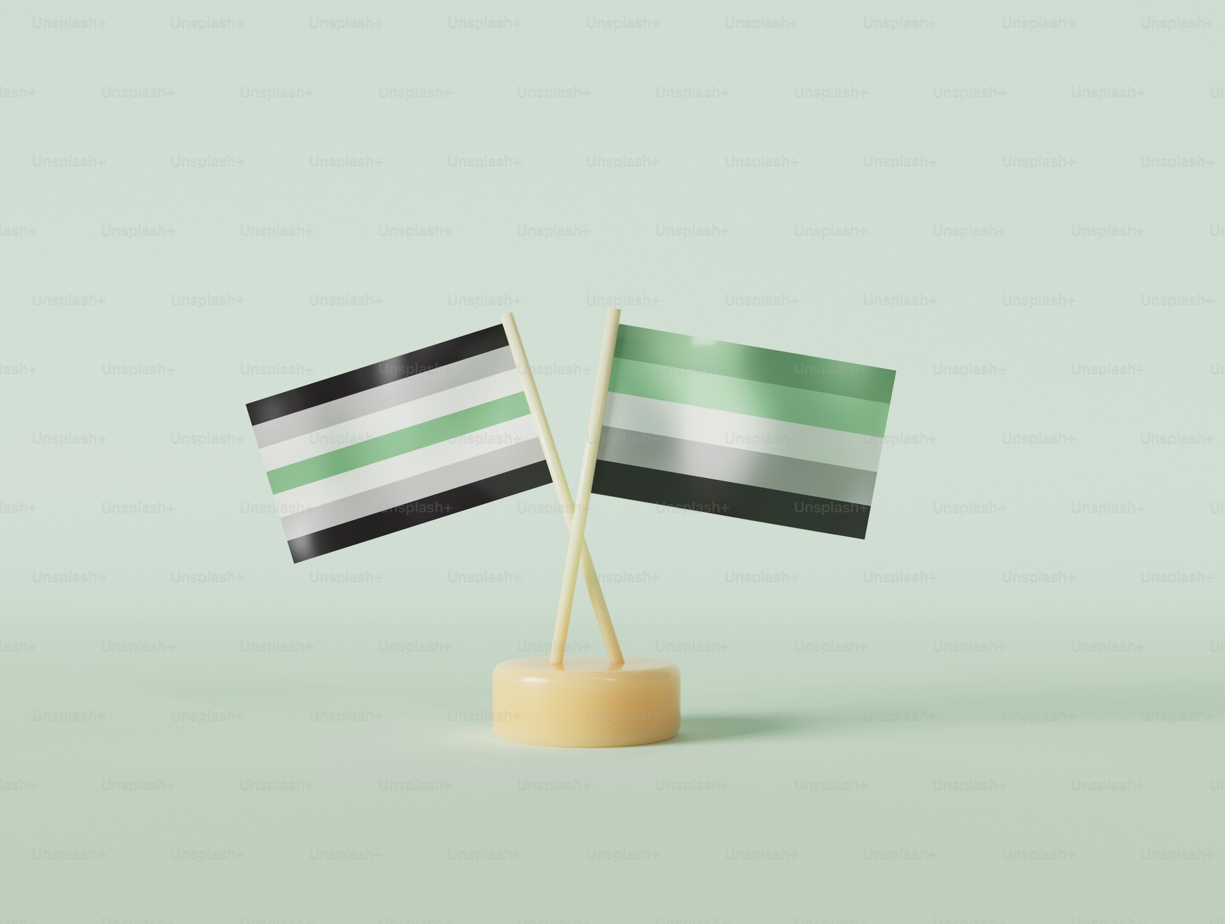 Two small flags on a small stand on a green background photo – Pride ...
