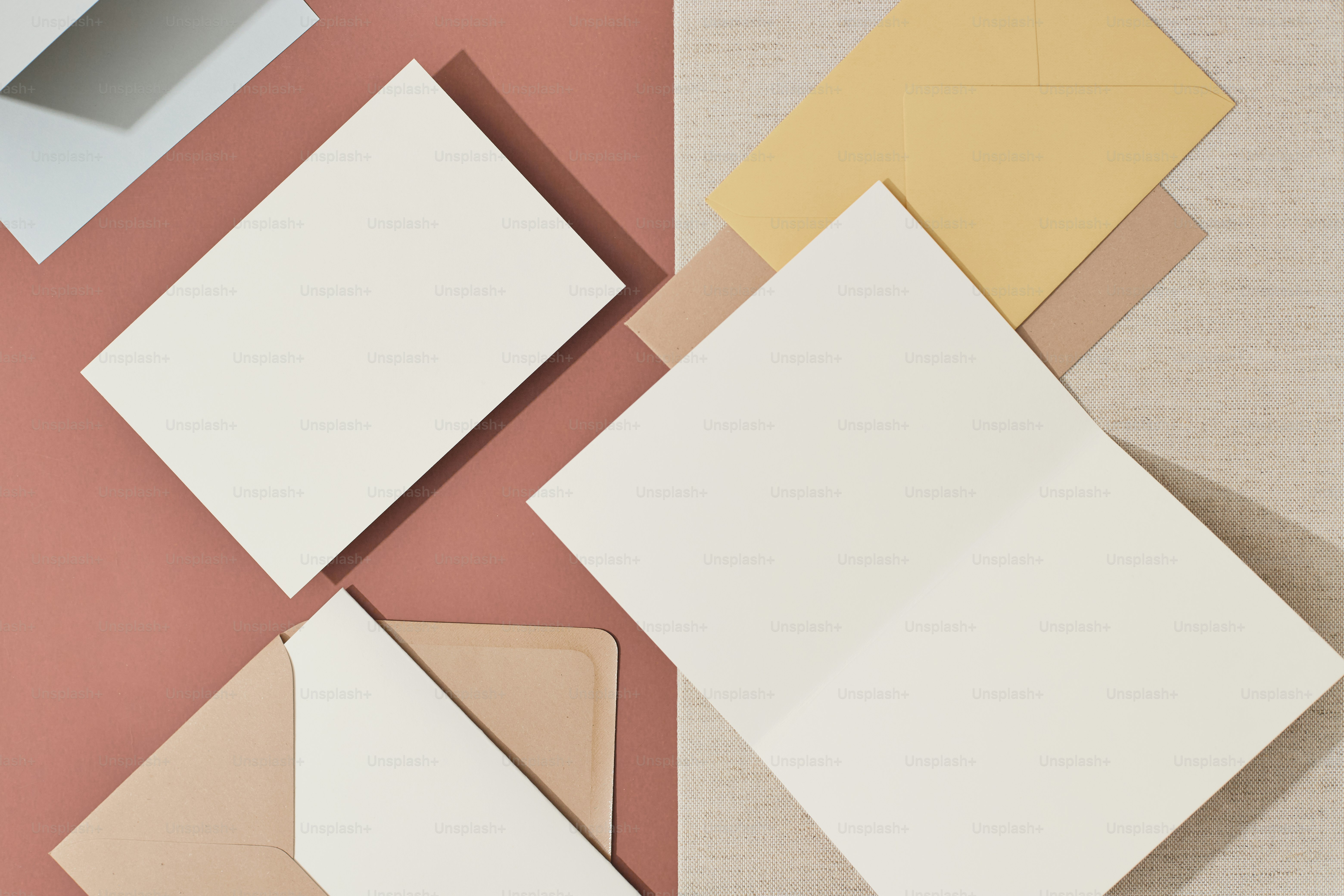 A table topped with lots of different colored papers photo – Template ...