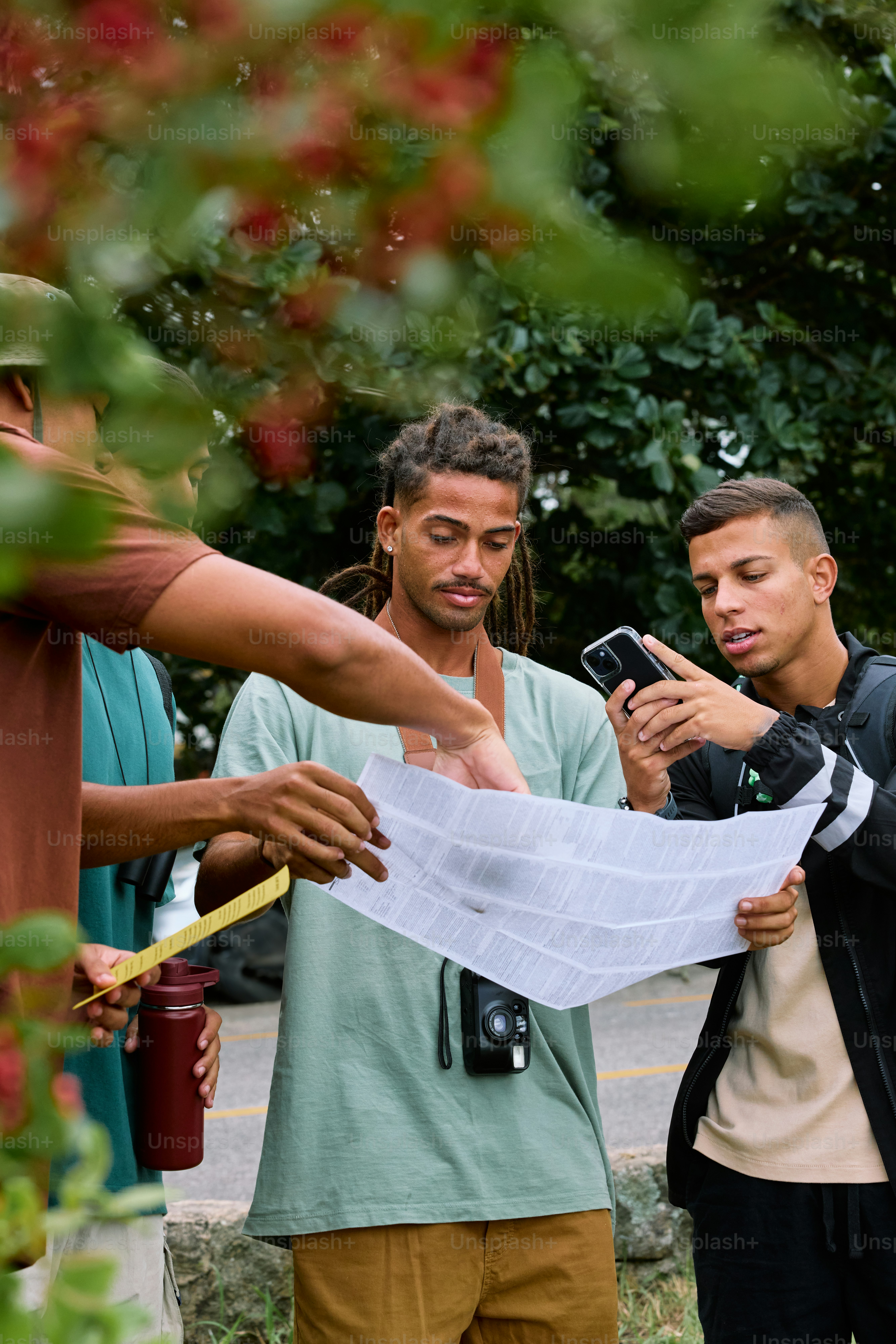 A couple of men standing next to each other photo – Adventure Image on ...