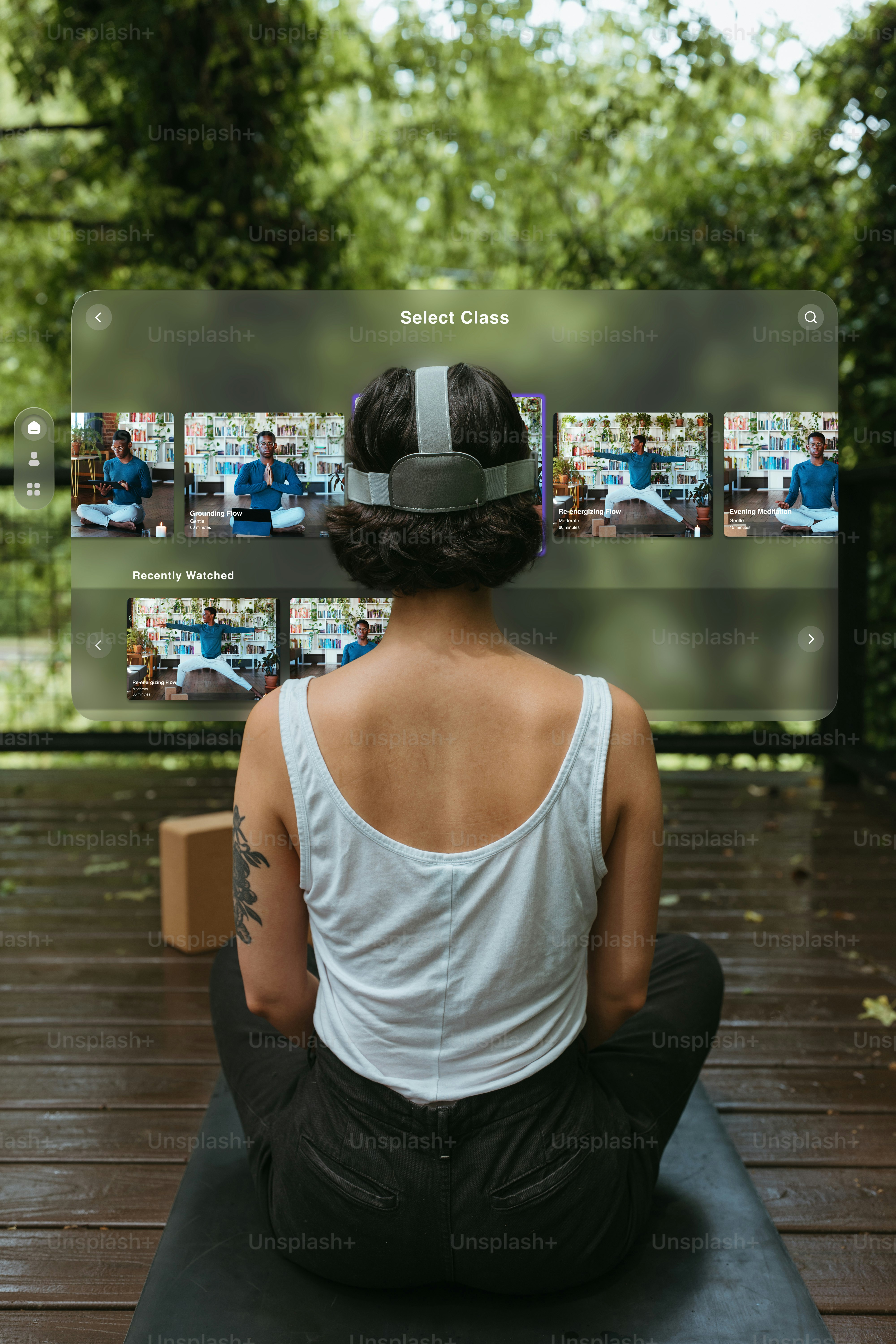 A woman sitting at a desk in front of a computer monitor photo ...