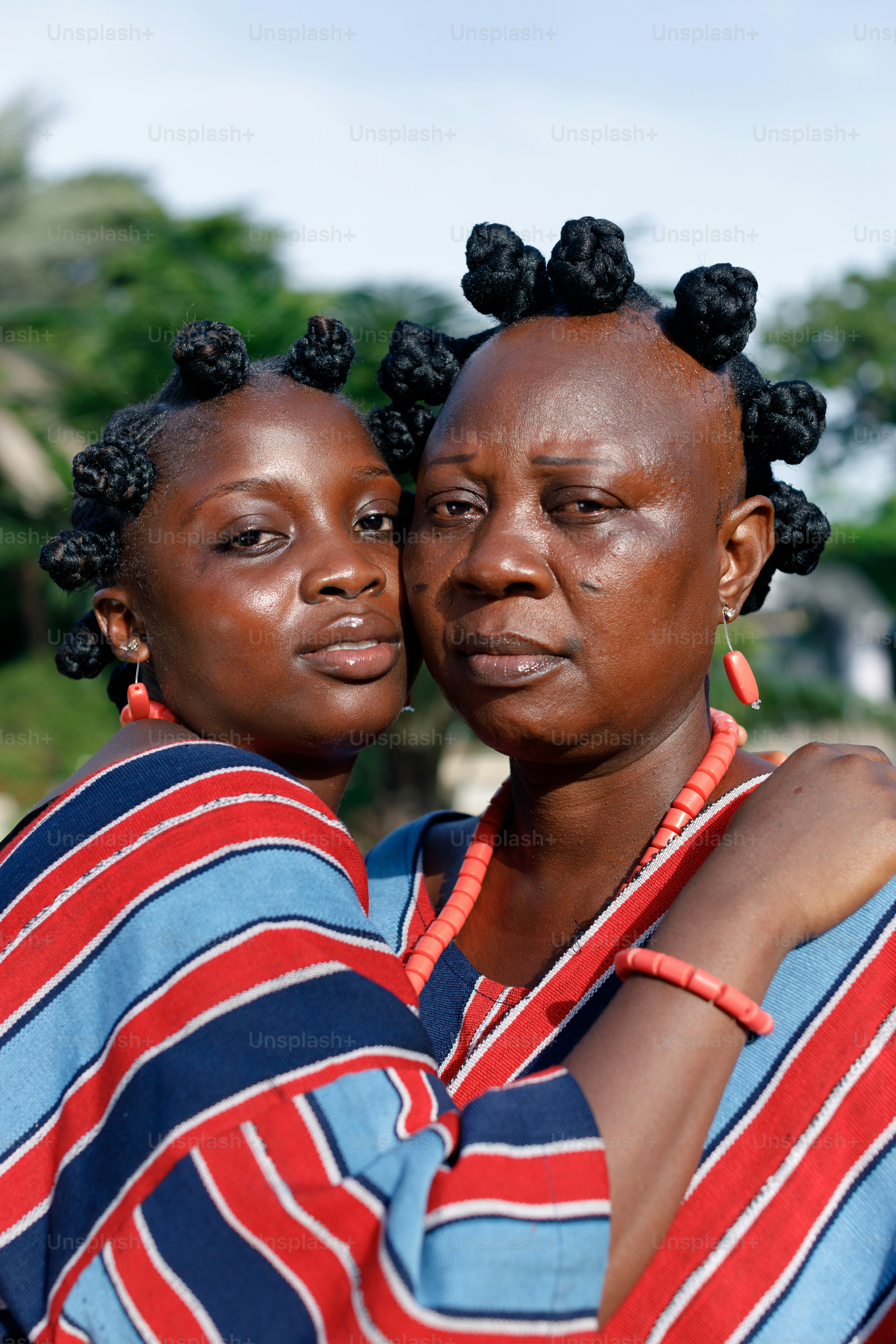 A couple of women standing next to each other photo – Indigenous people ...