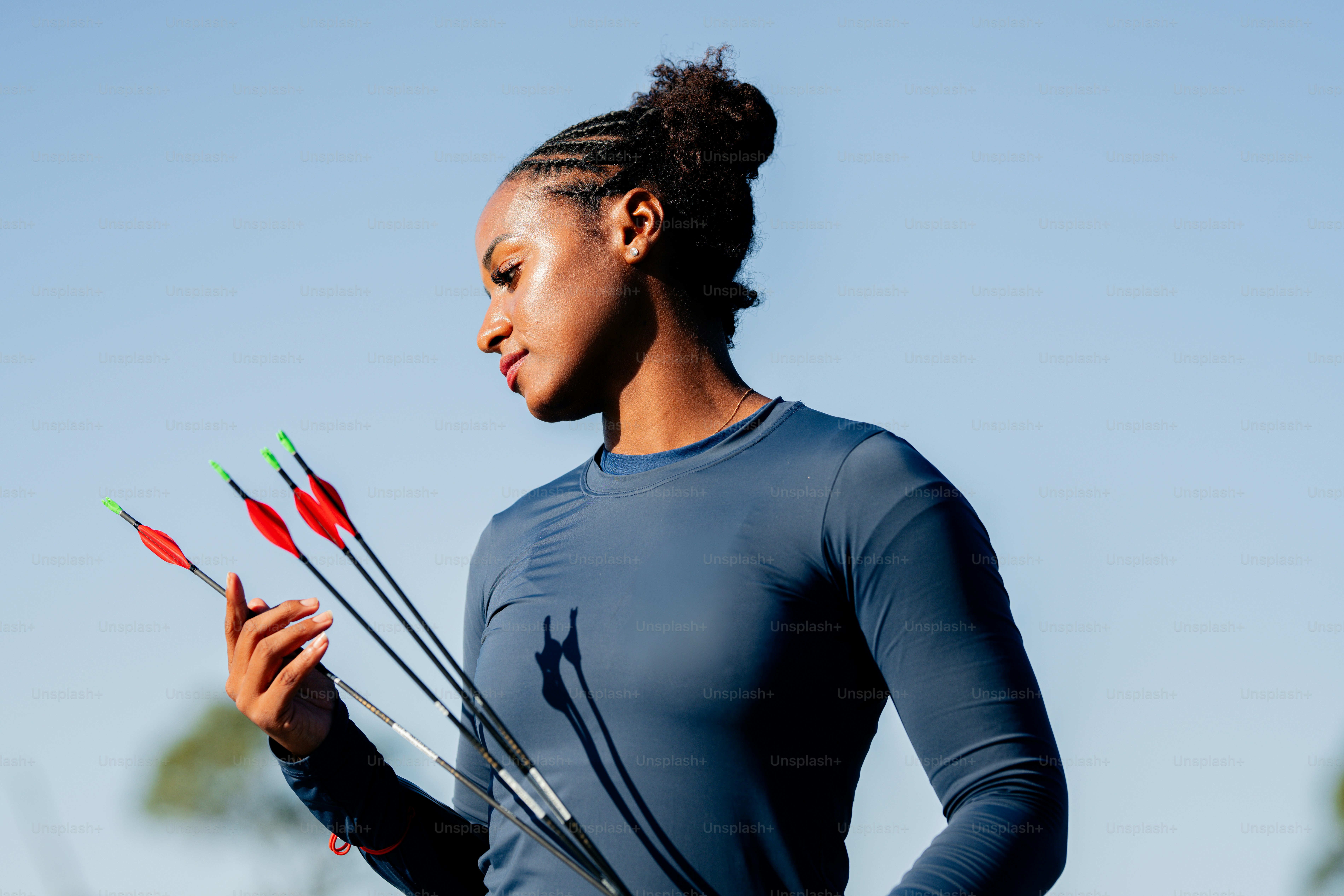 A close up of a target with arrows in it photo – Archery Image on Unsplash