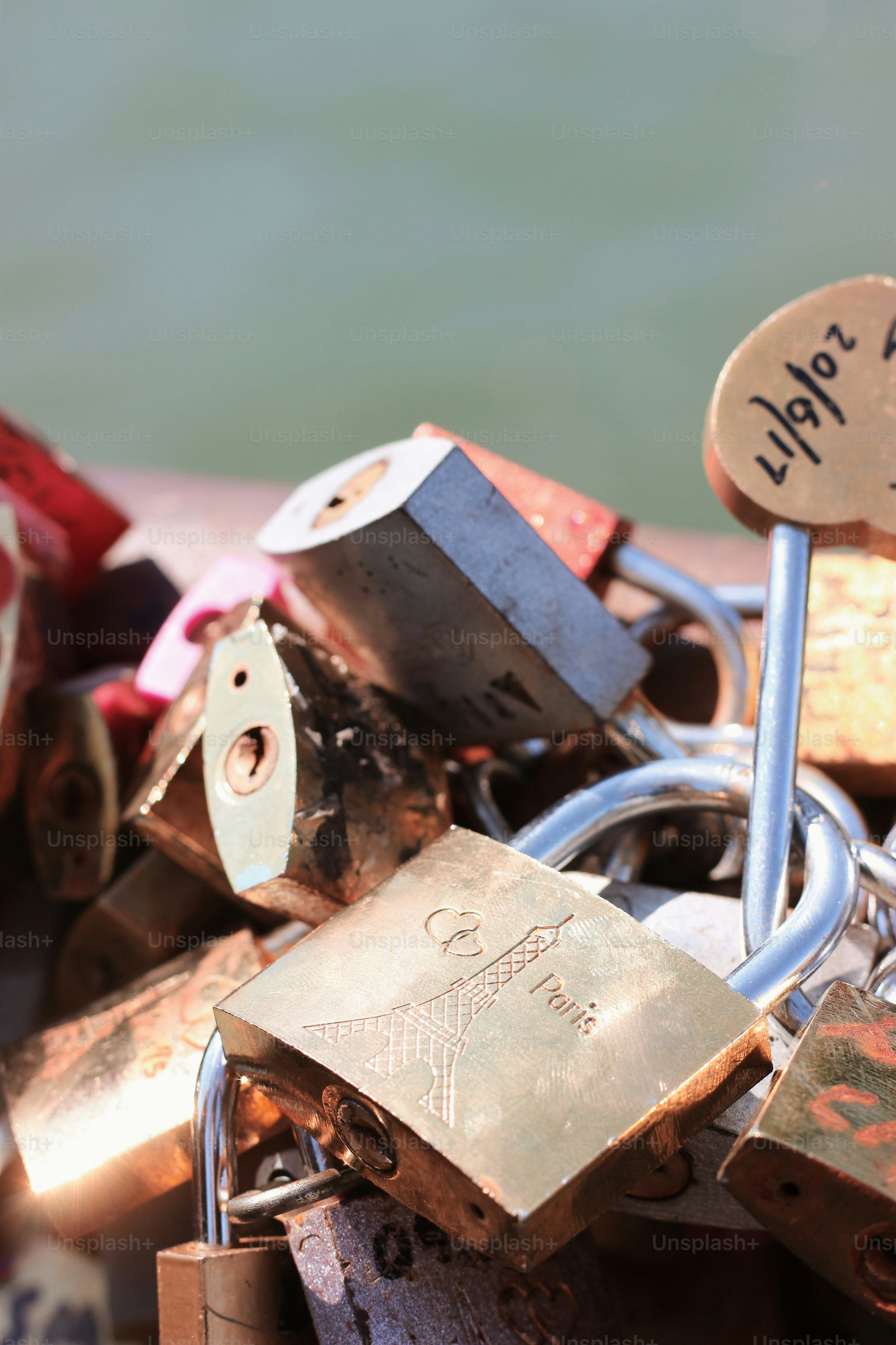A bunch of padlocks that have been locked together photo – Paris Image ...