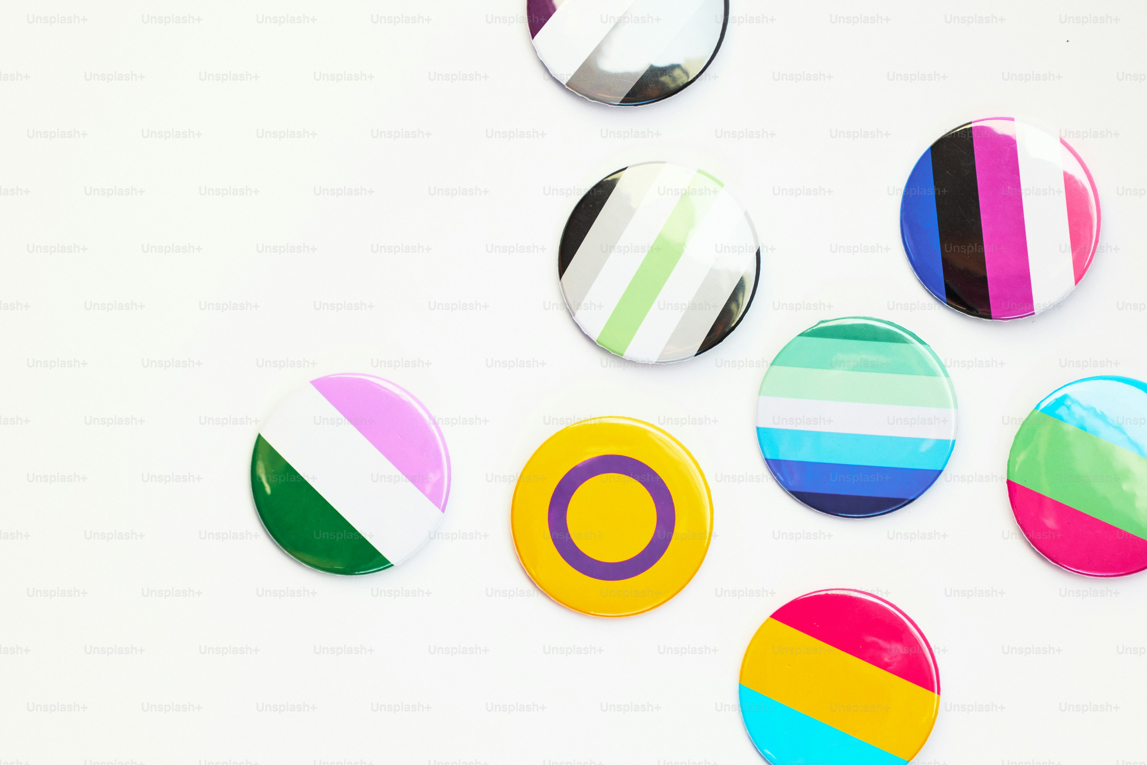 A group of pins sitting on top of a white surface photo – Community ...