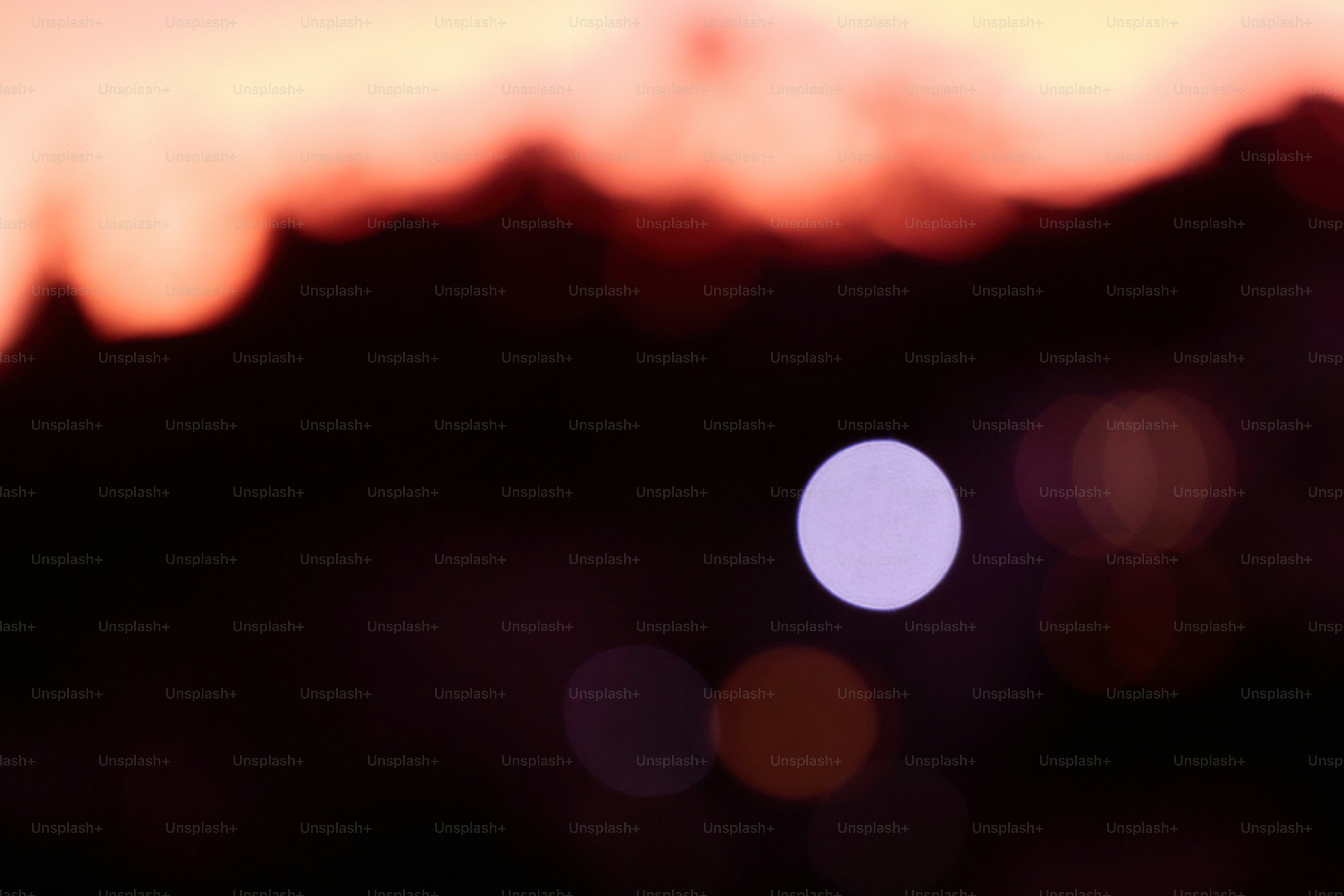 A blurry photo of a cell phone with a blurry background photo – Light ...