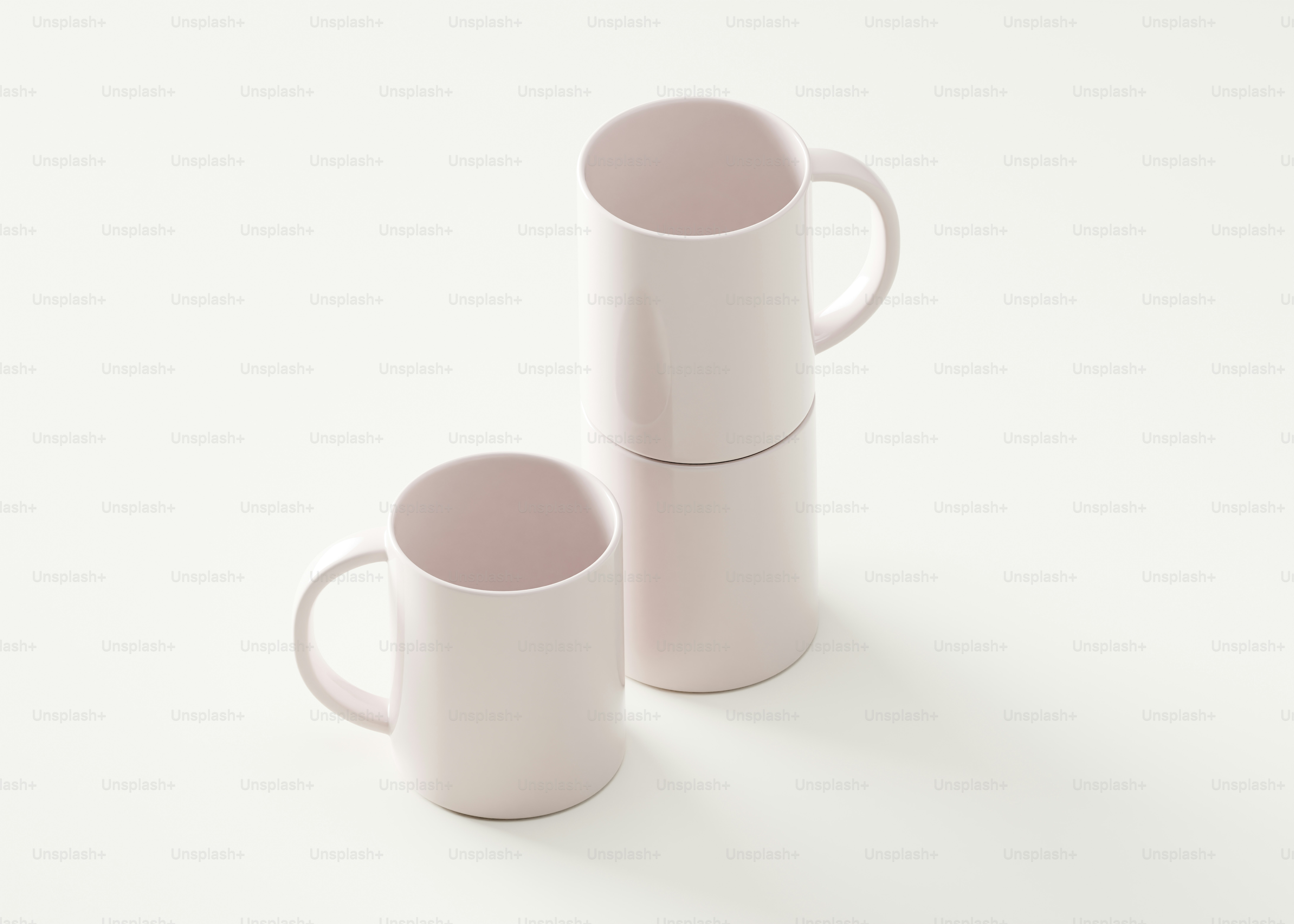 A stack of three cups sitting on top of a table photo – Mockup mug ...