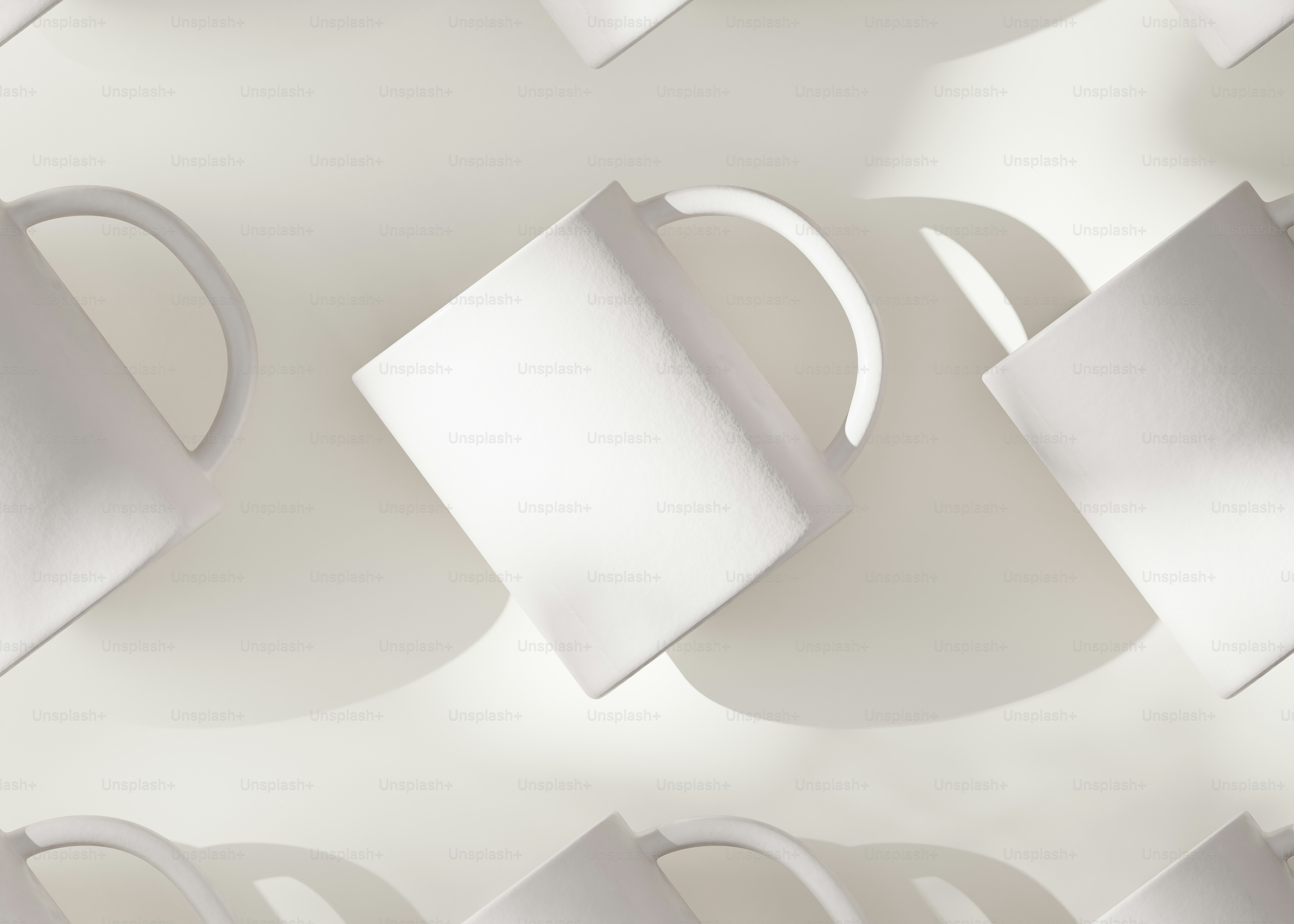 A stack of three cups sitting on top of a table photo – Mockup mug ...