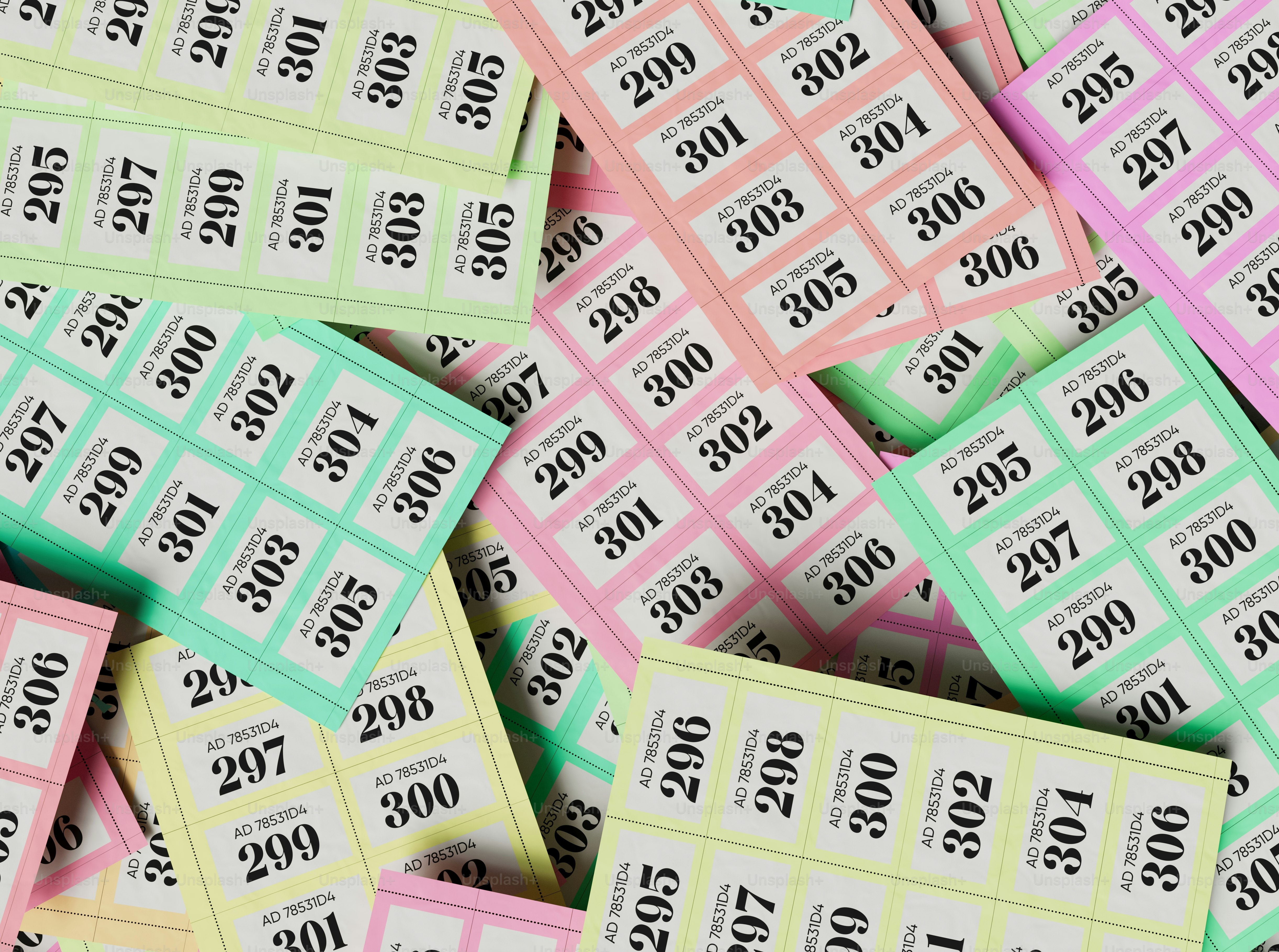 A pile of colorful tickets sitting on top of each other photo – Raffle ...