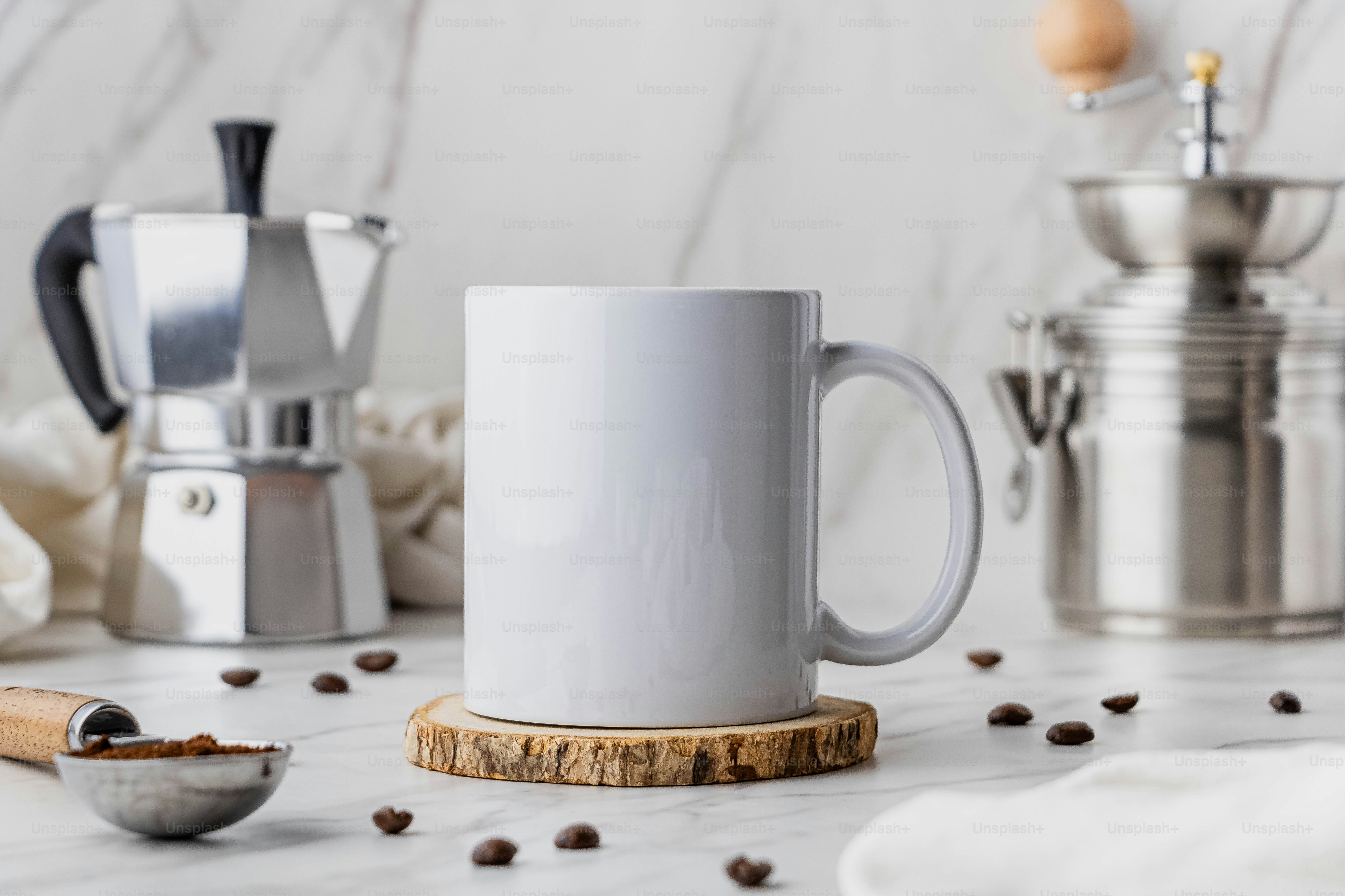 A white coffee mug sitting on top of a counter photo – Mug Image on ...